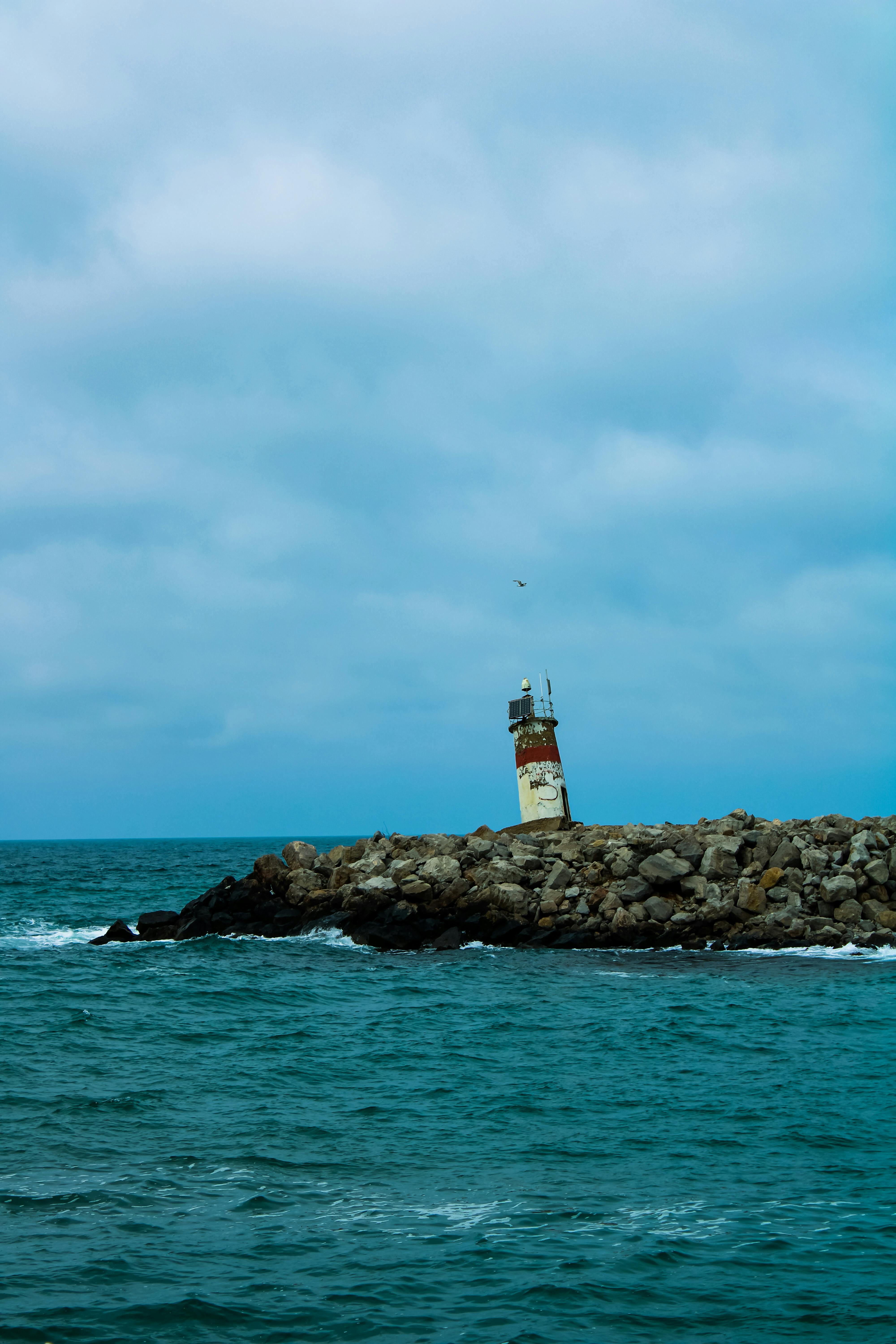 Destroyed Lighthouse on Sea Shore · Free Stock Photo