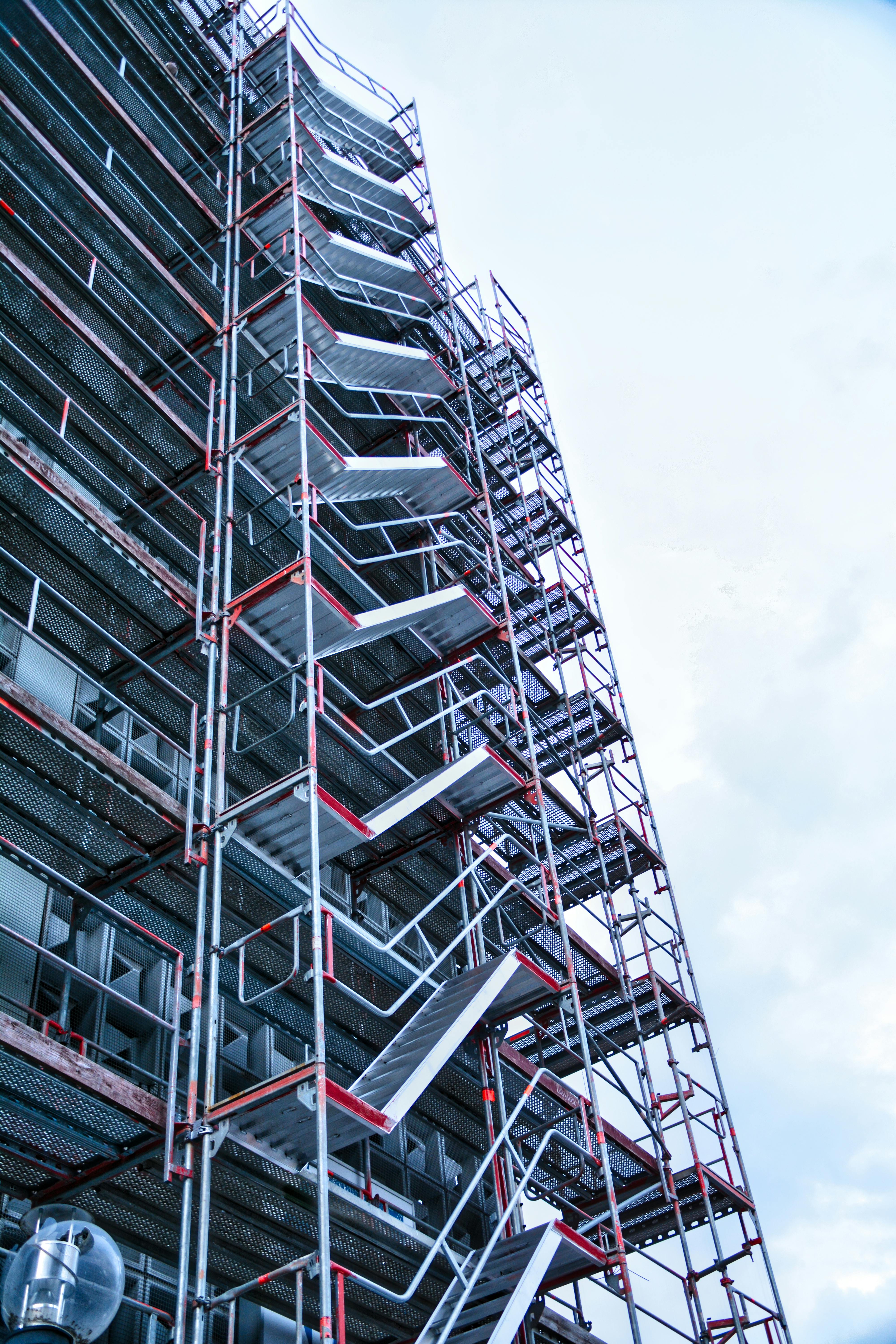 Scaffolding by Building Wall · Free Stock Photo