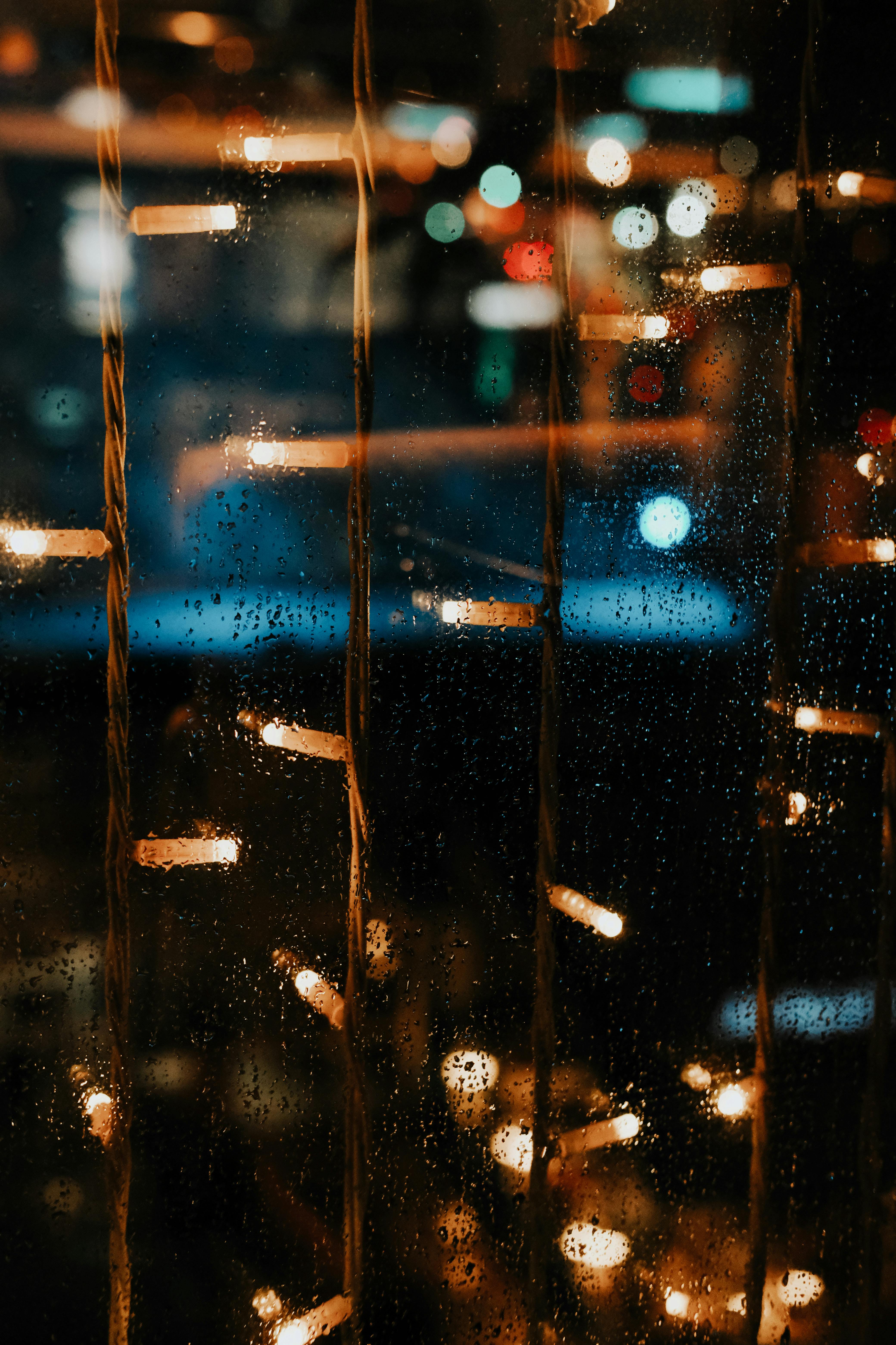 Blurry Lights behind a Wet Window · Free Stock Photo