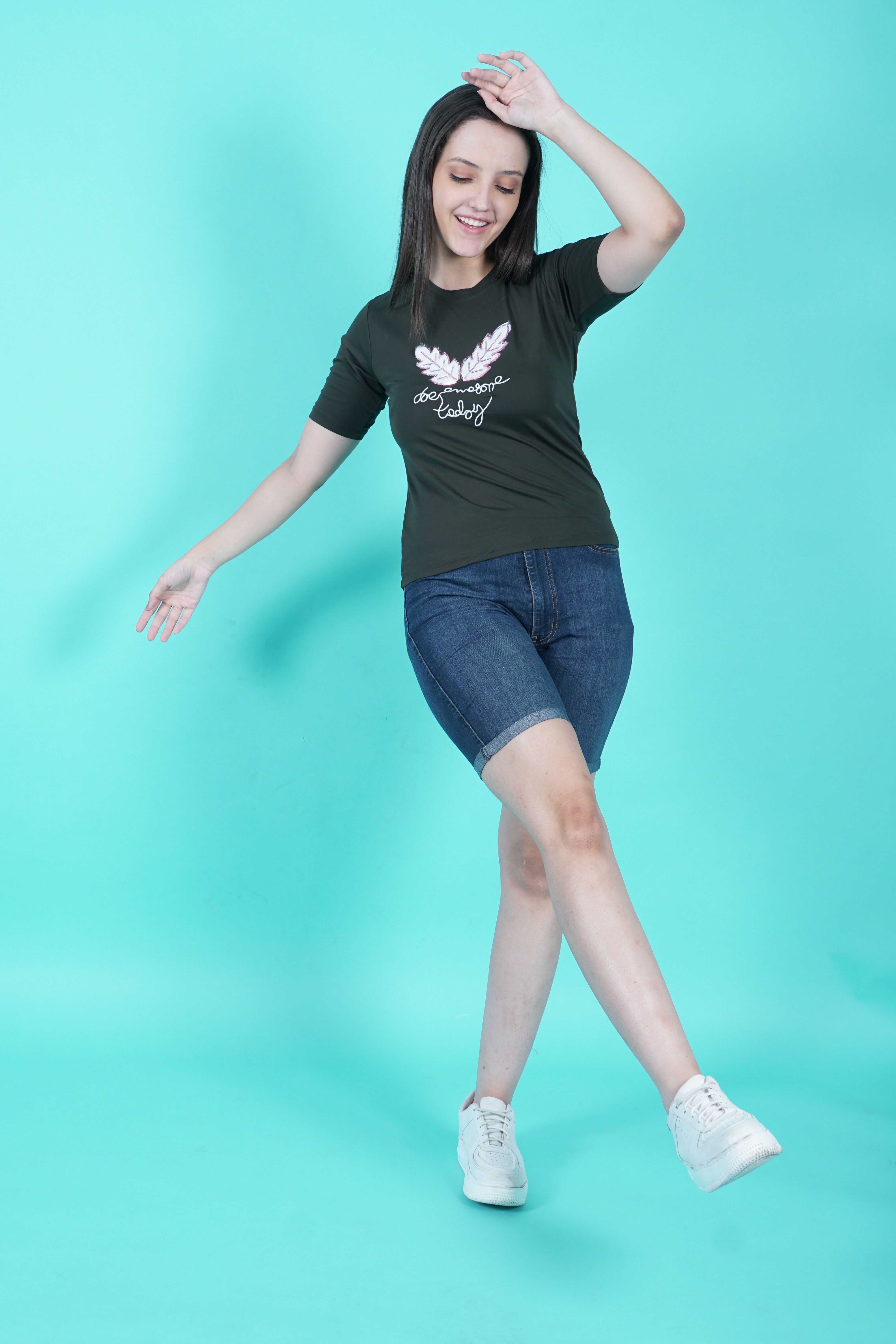 Woman Smiling and Posing on Blue Background · Free Stock Photo