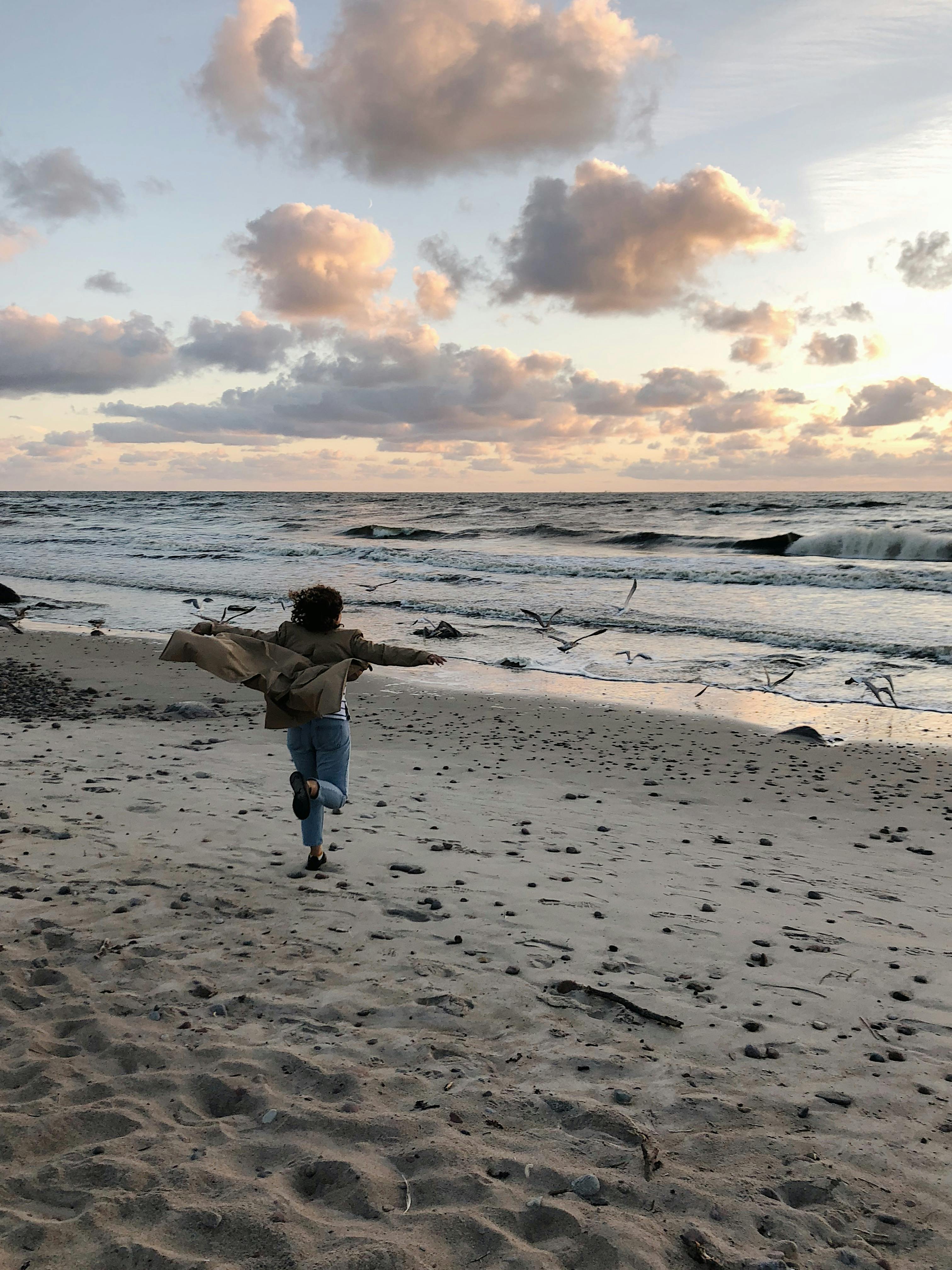 Person Running On Shore · Free Stock Photo