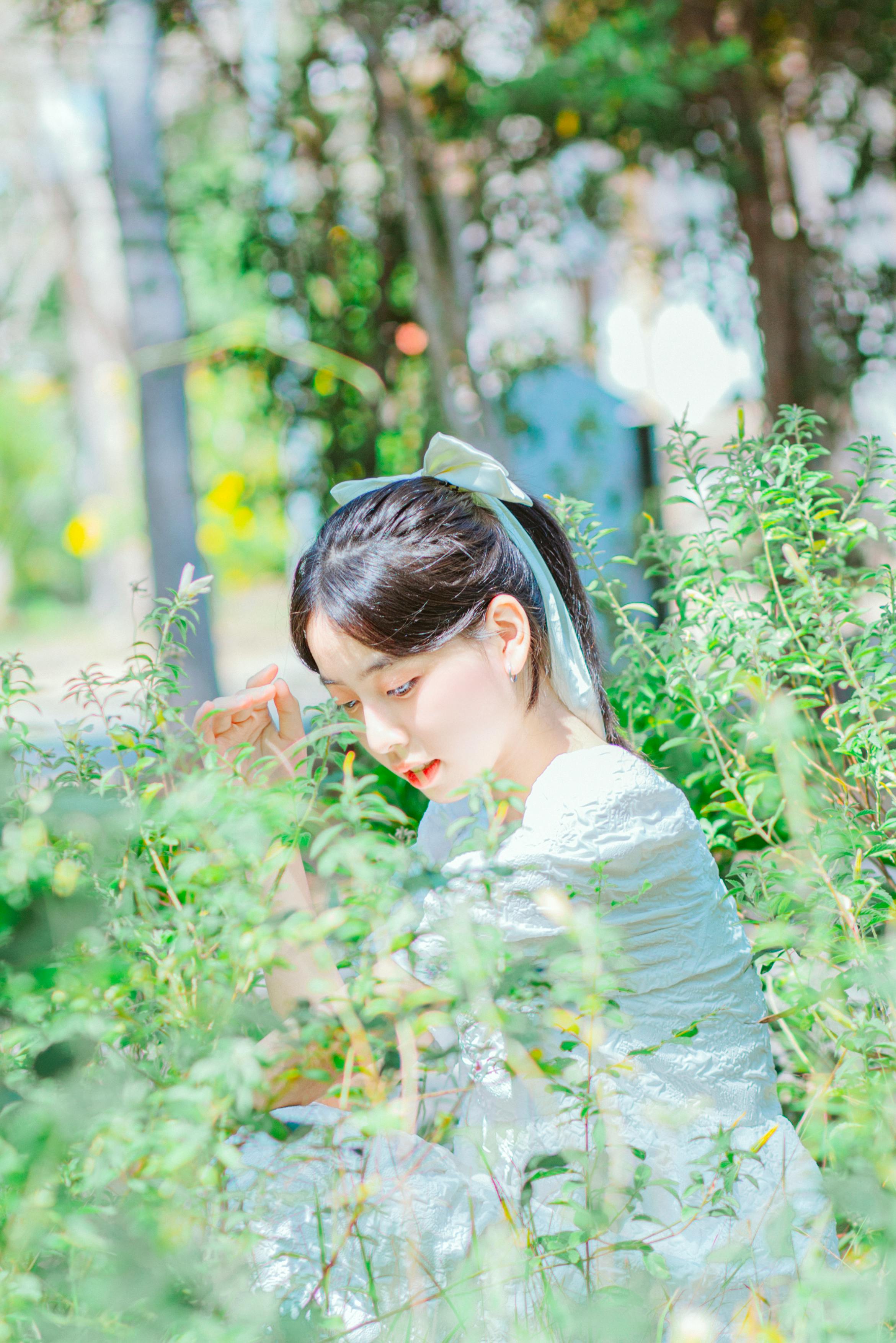 Woman Posing among Plants · Free Stock Photo