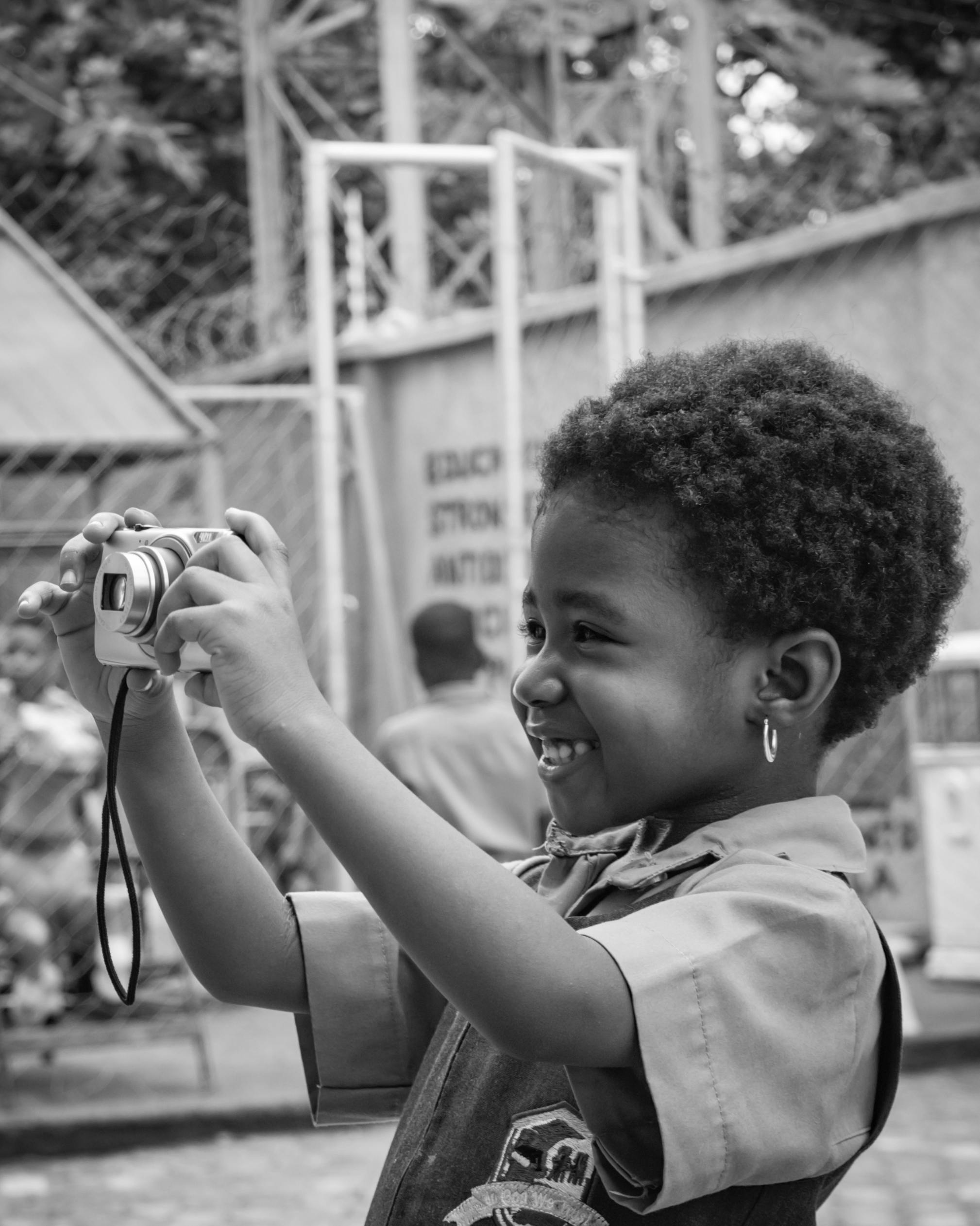 Small Child Taking Photos with Compact Camera · Free Stock Photo