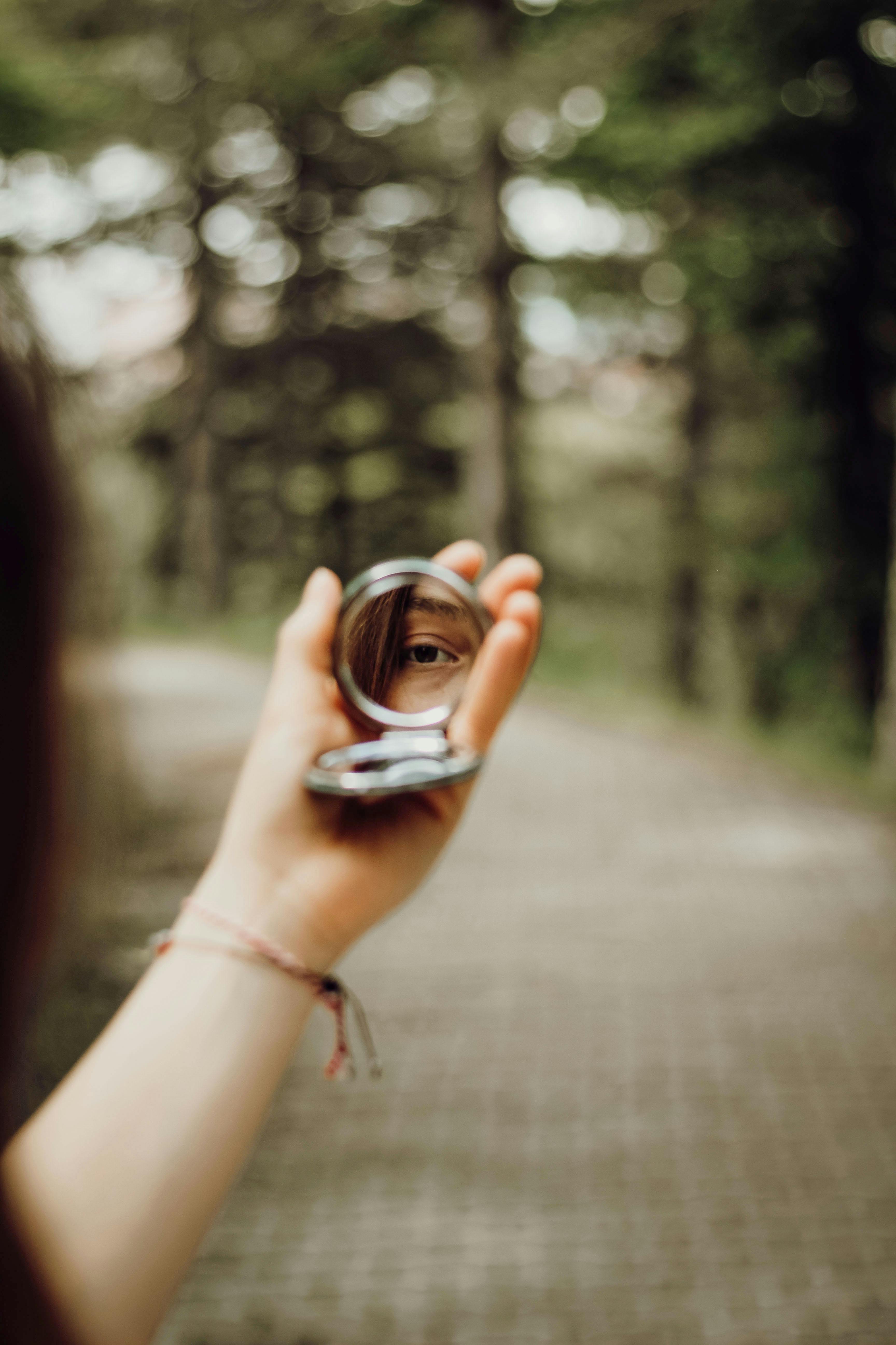 Eye Reflection in Hand Mirror · Free Stock Photo