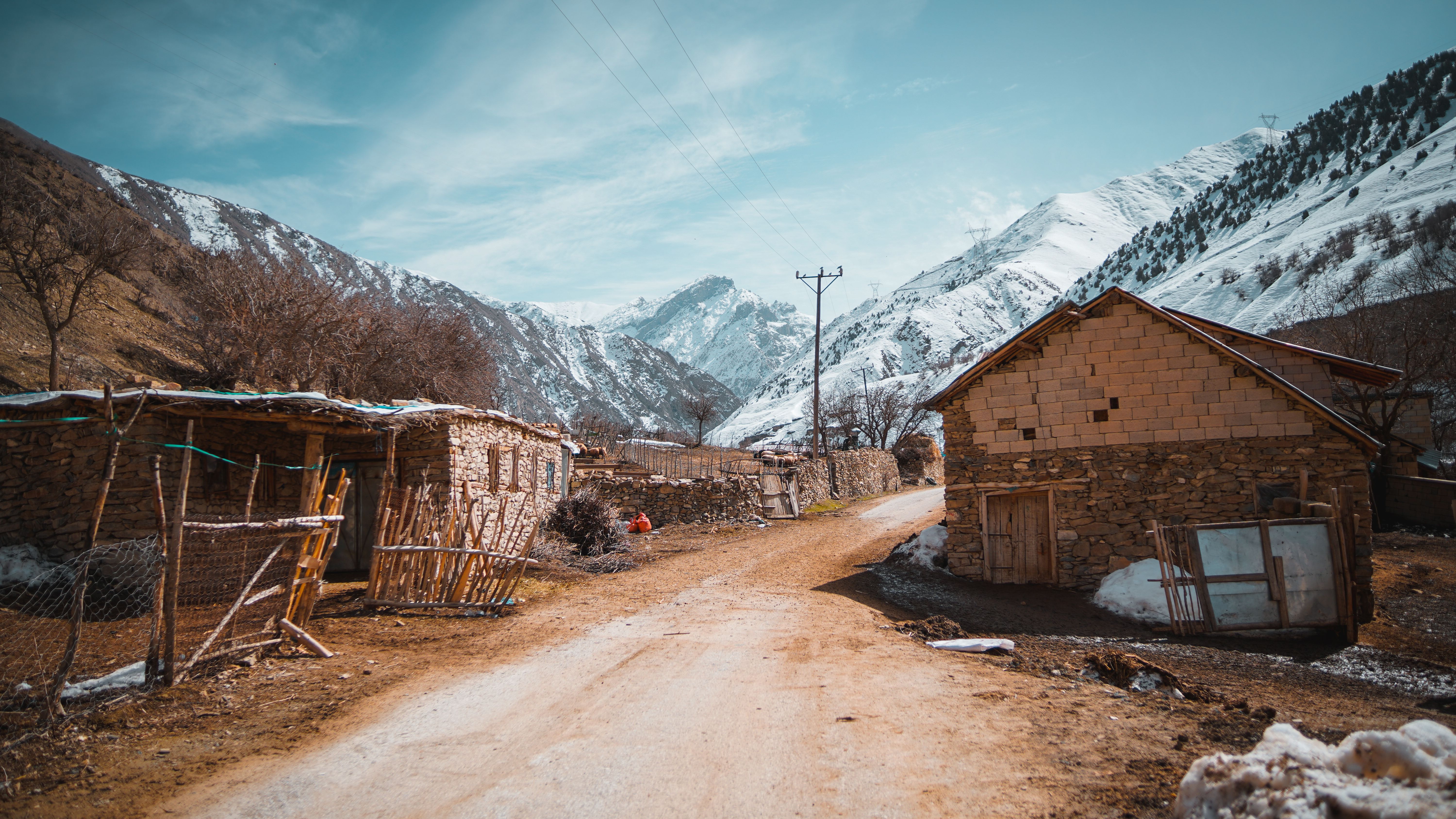 Road Stretching Through a Remote Mountain Village · Free Stock Photo