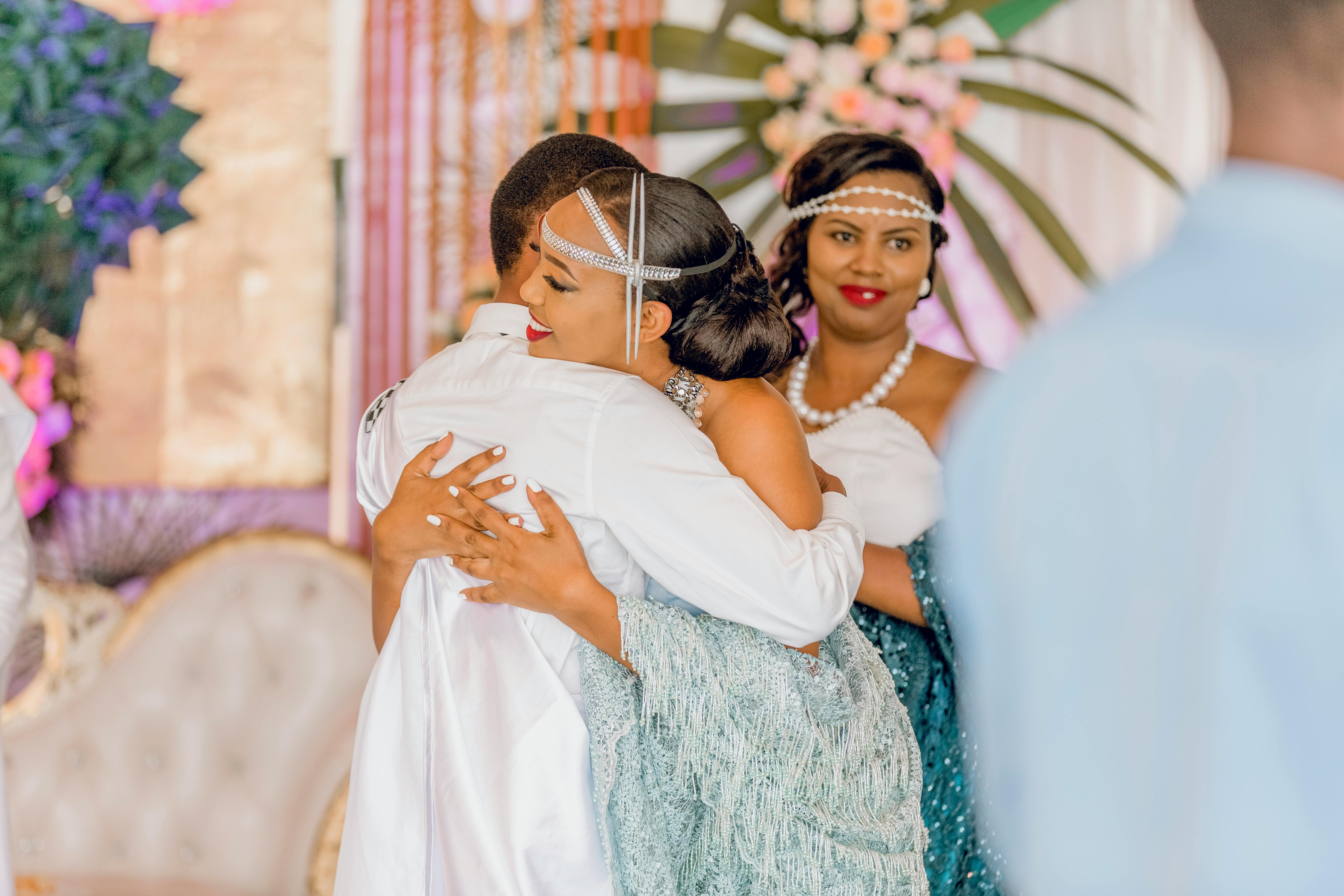 The Bride Hugging Family Members at the Wedding · Free Stock Photo