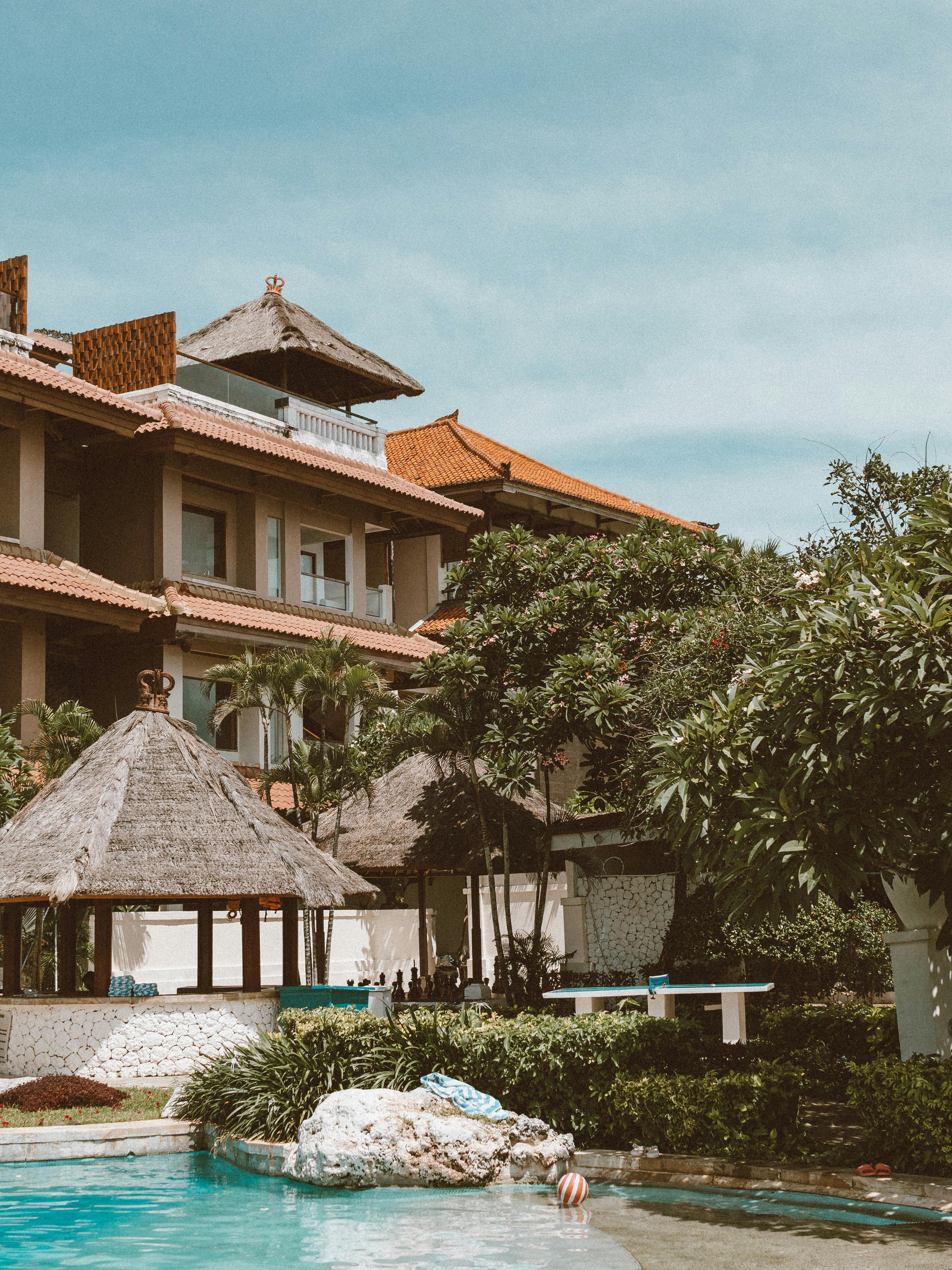 View of Swimming Pool and Cottages in Resort · Free Stock Photo