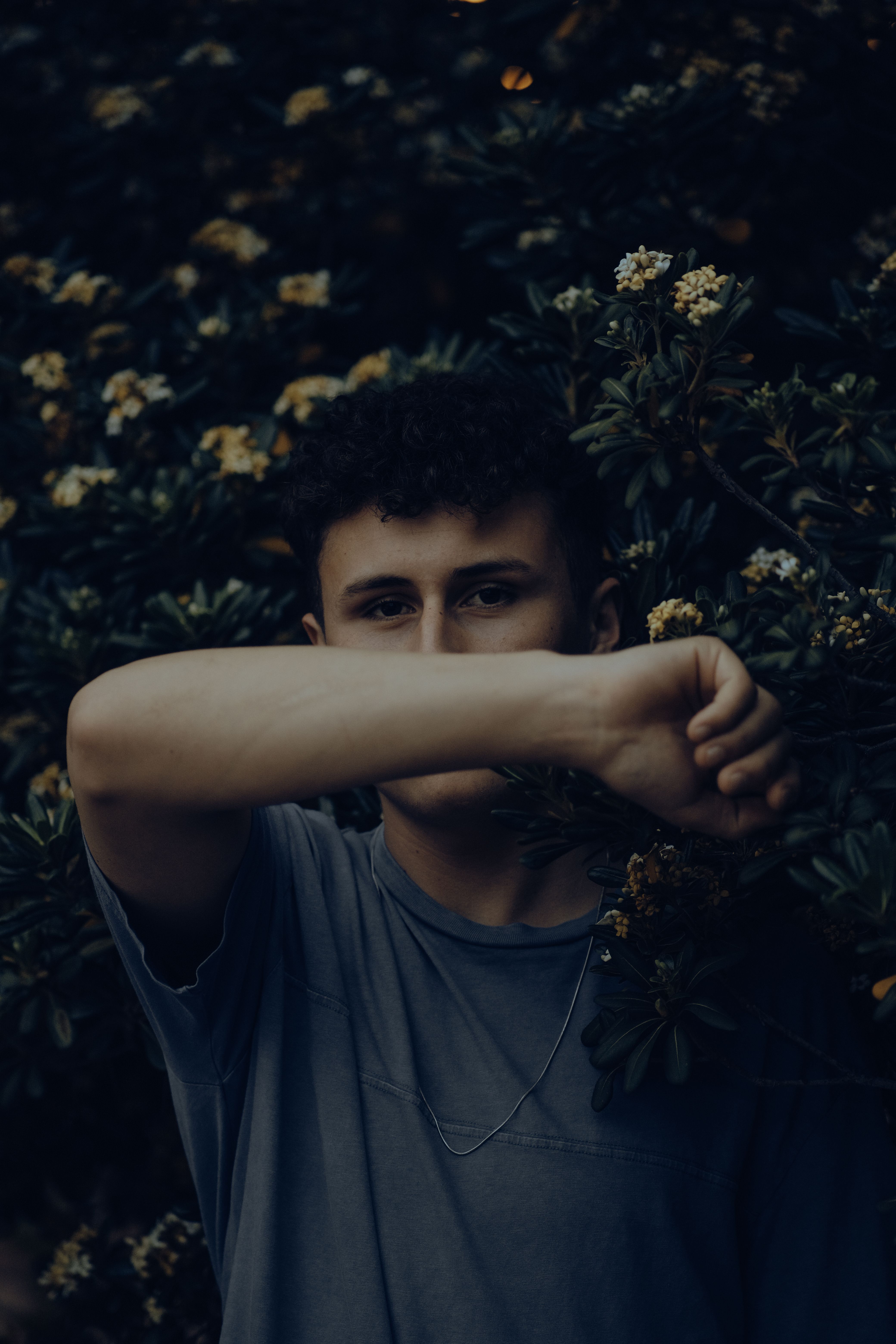 Man Covering his Face with his Forearm · Free Stock Photo