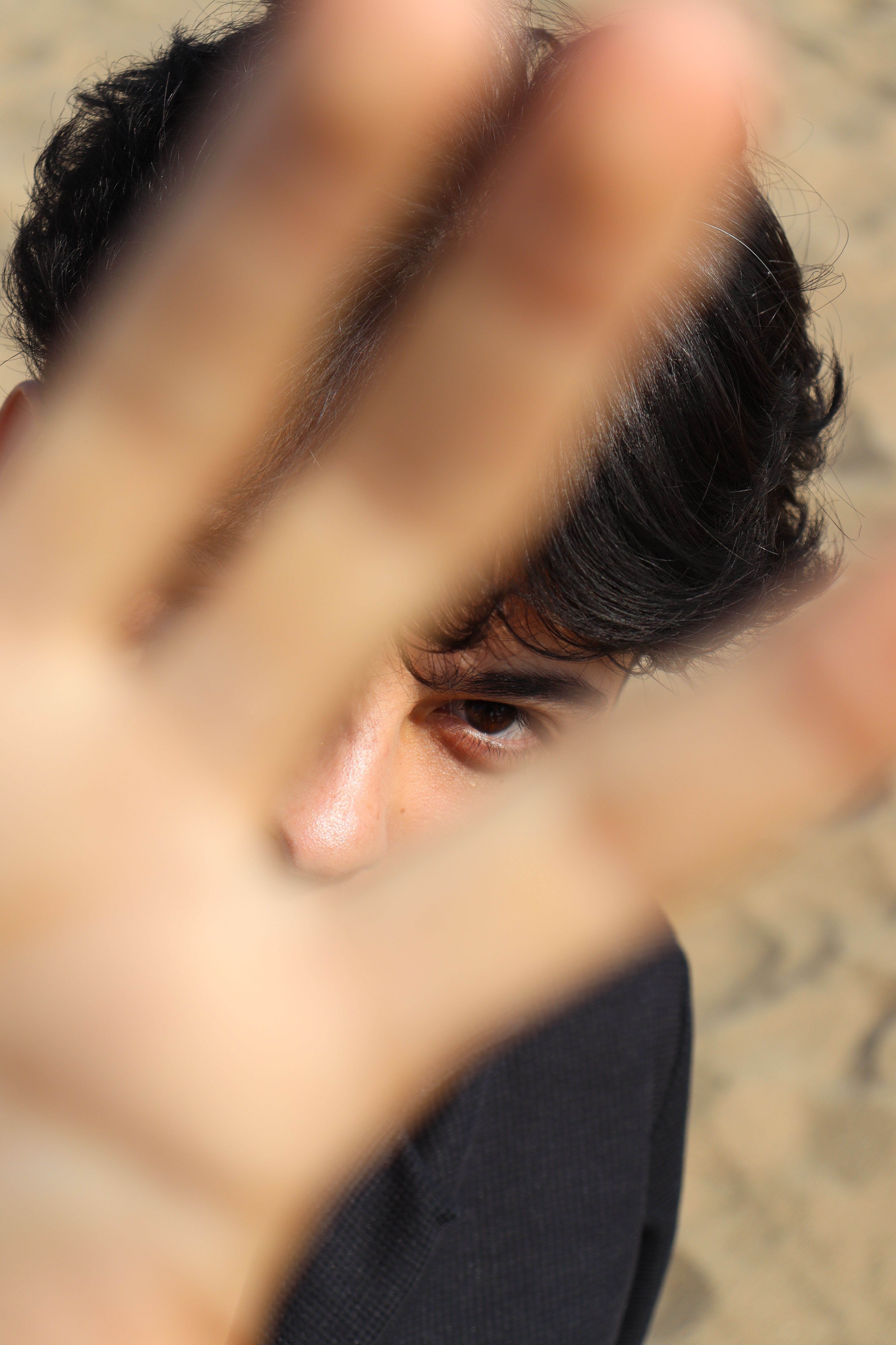 Man Covering Lens by Hand · Free Stock Photo