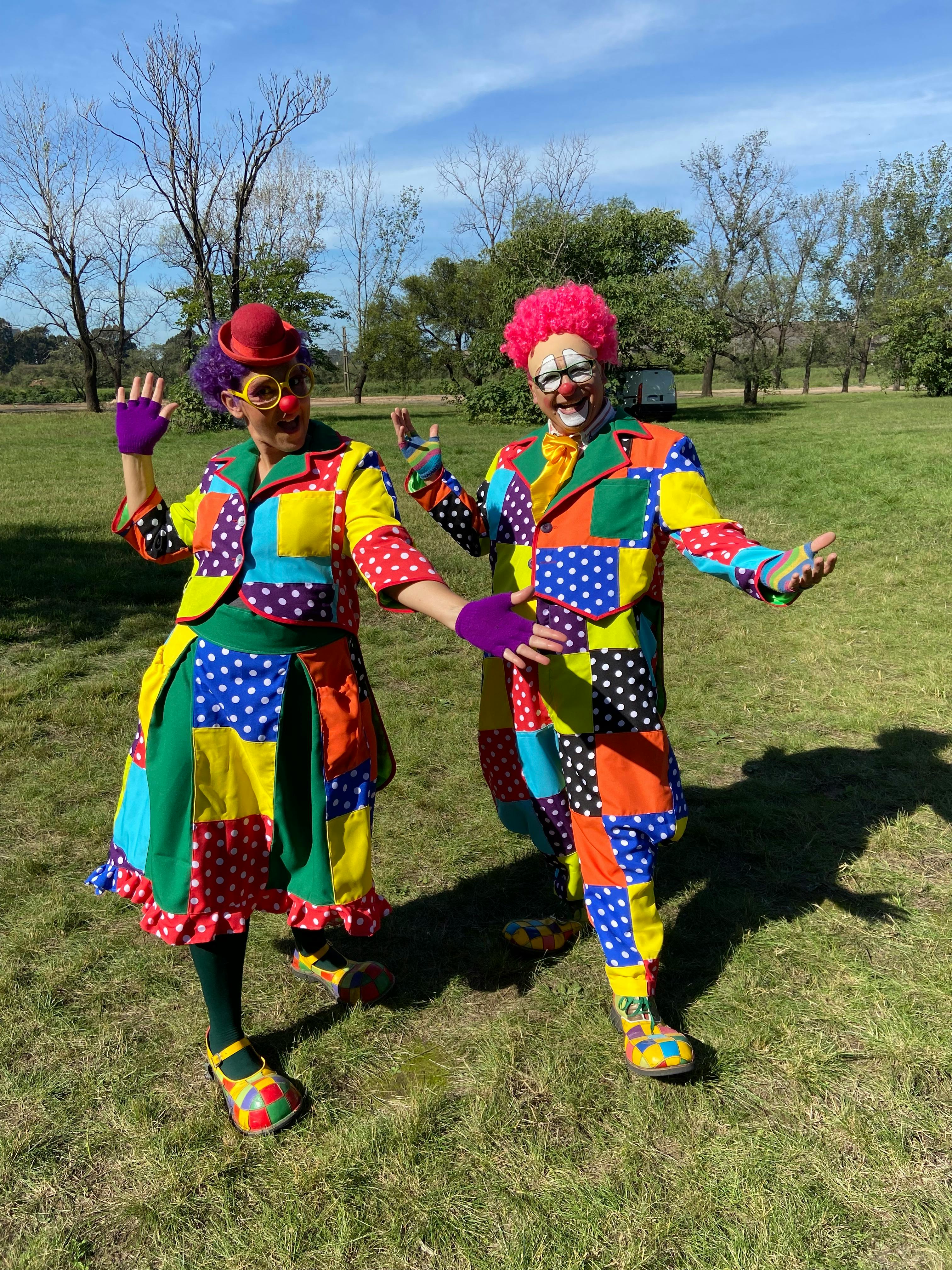 Smiling Woman and Man in Clowns Costumes · Free Stock Photo