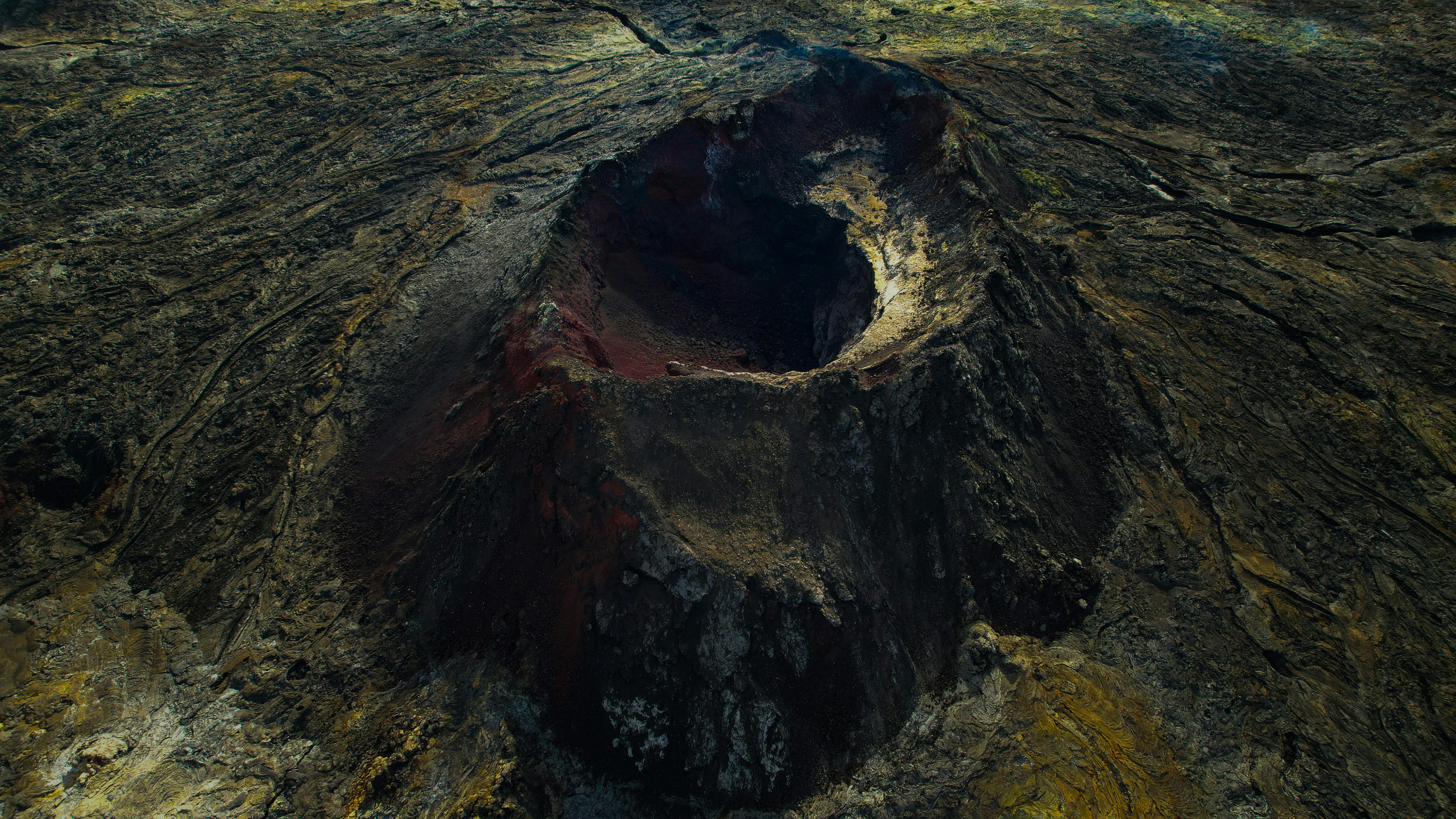 An aerial view of a volcano with a crater · Free Stock Photo
