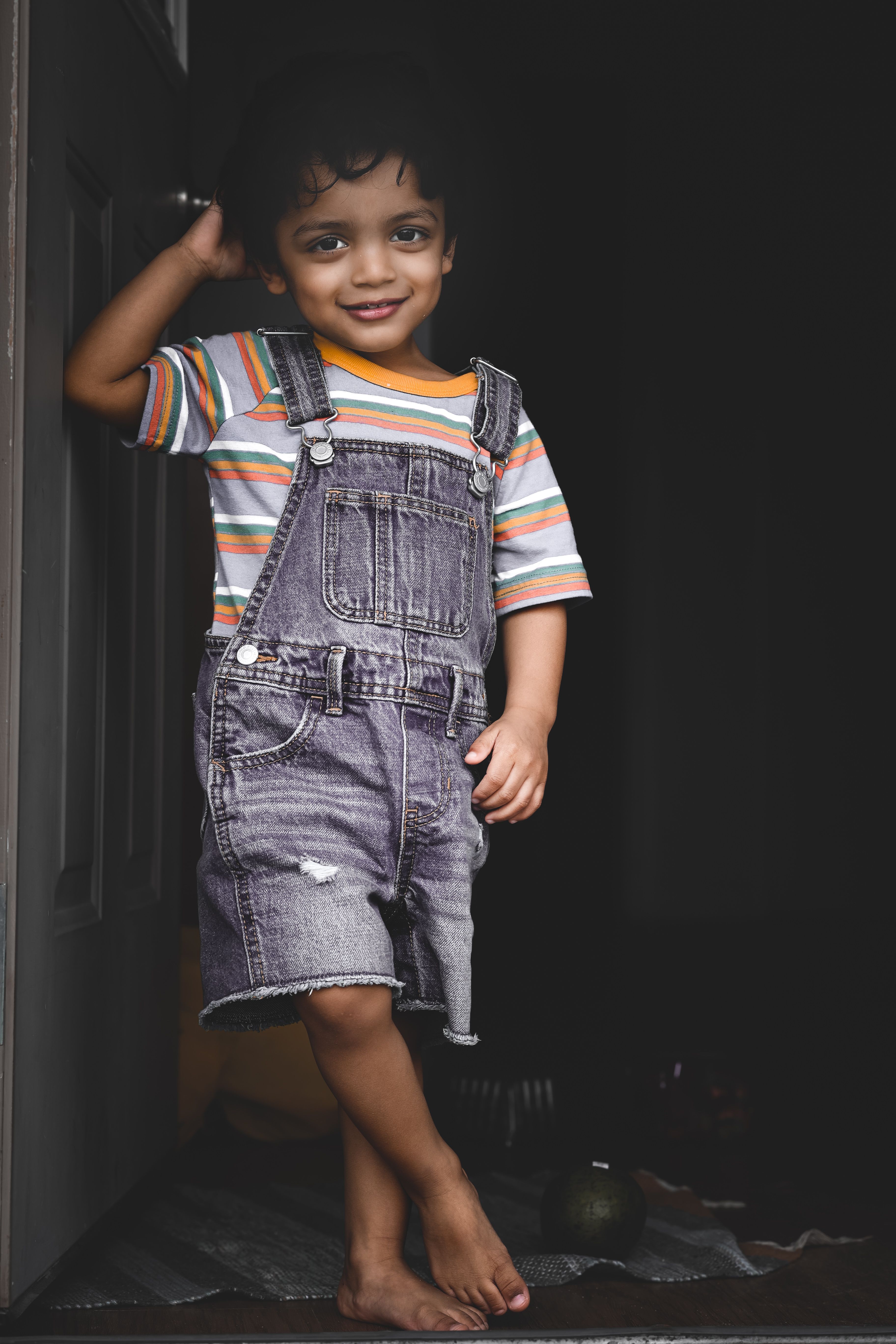 Child in Shorts and Multi Colored Striped T-shirt · Free Stock Photo