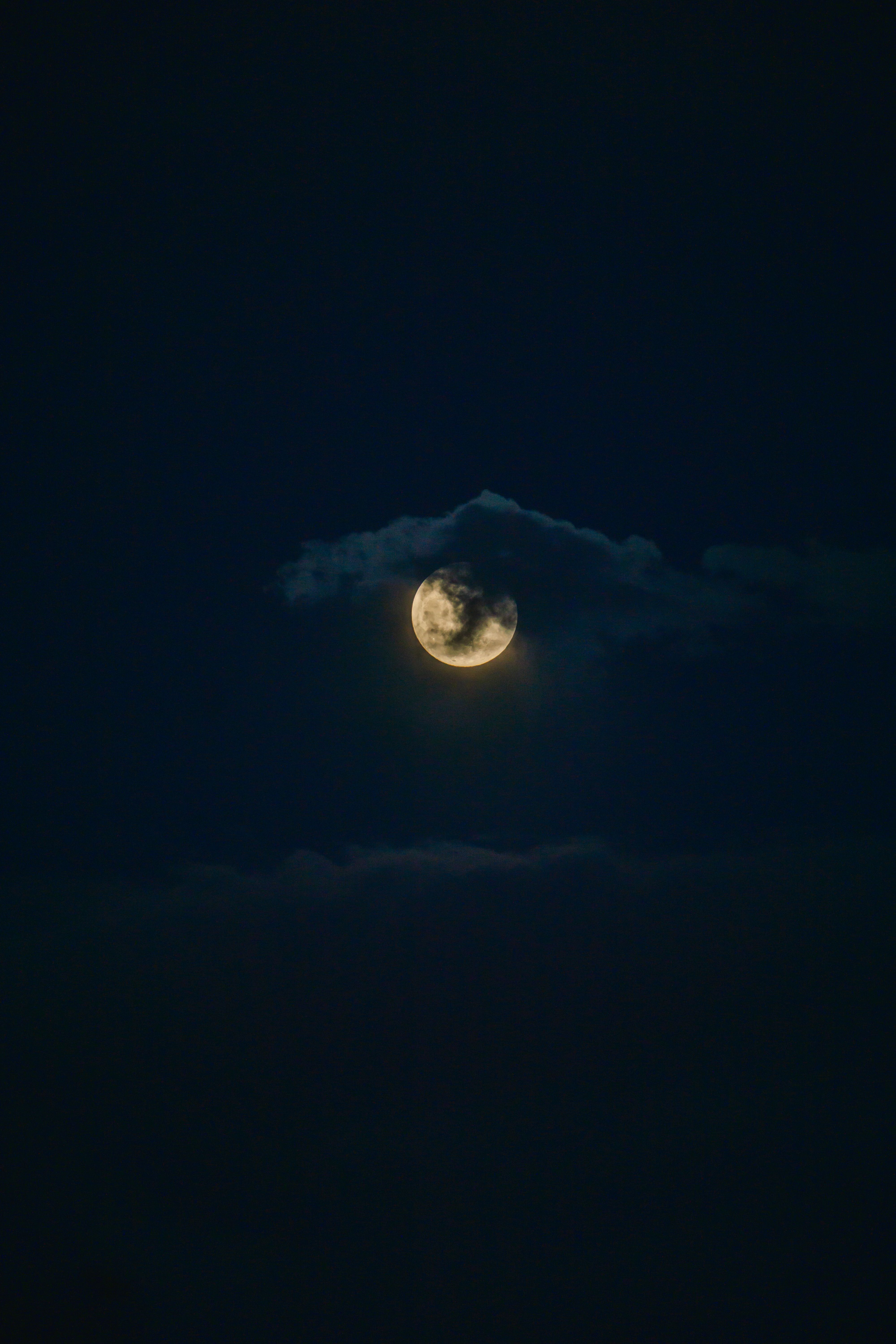 Full Moon Partially Obscured by Cloud · Free Stock Photo