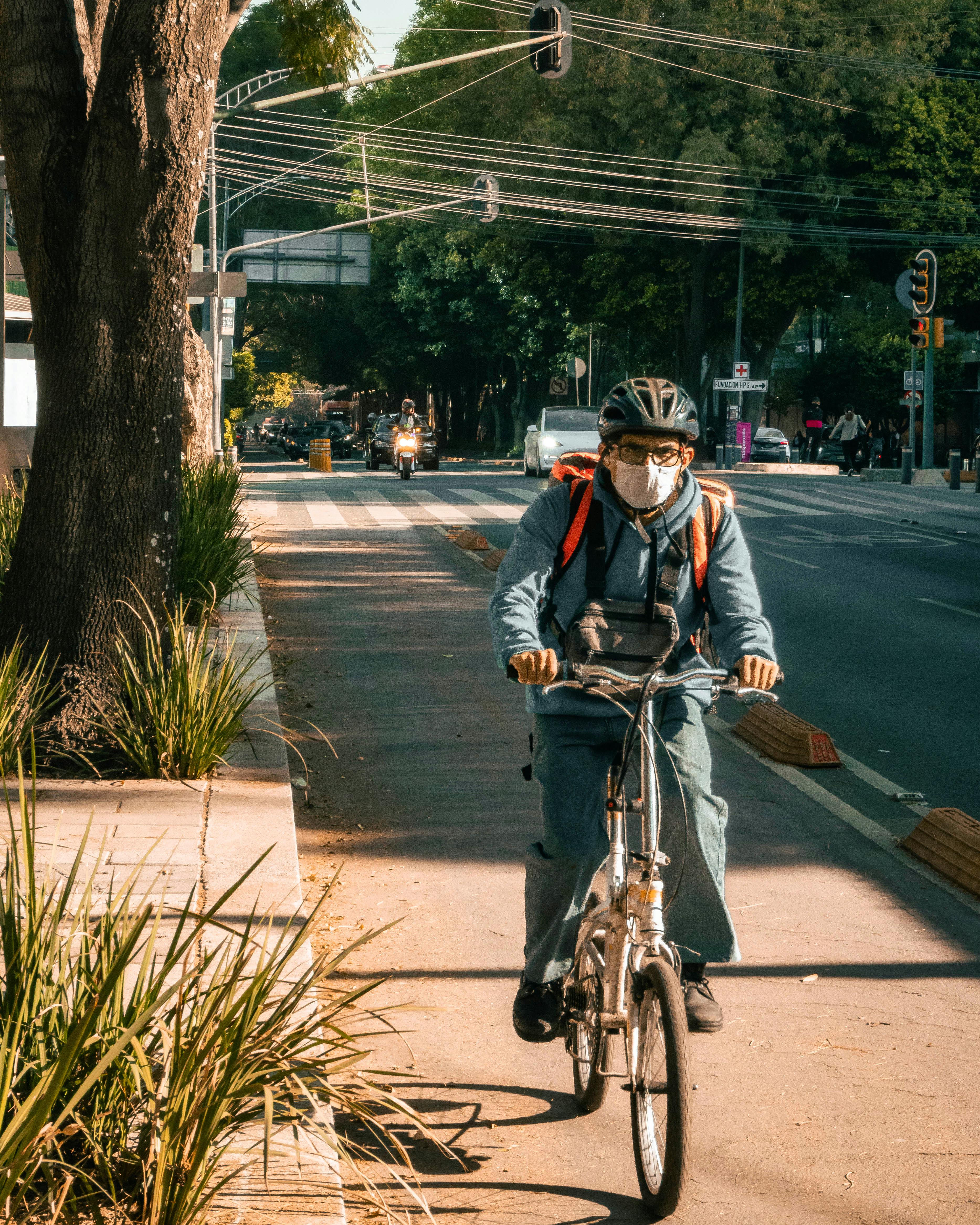 Cyclist Wearing Face Mask · Free Stock Photo