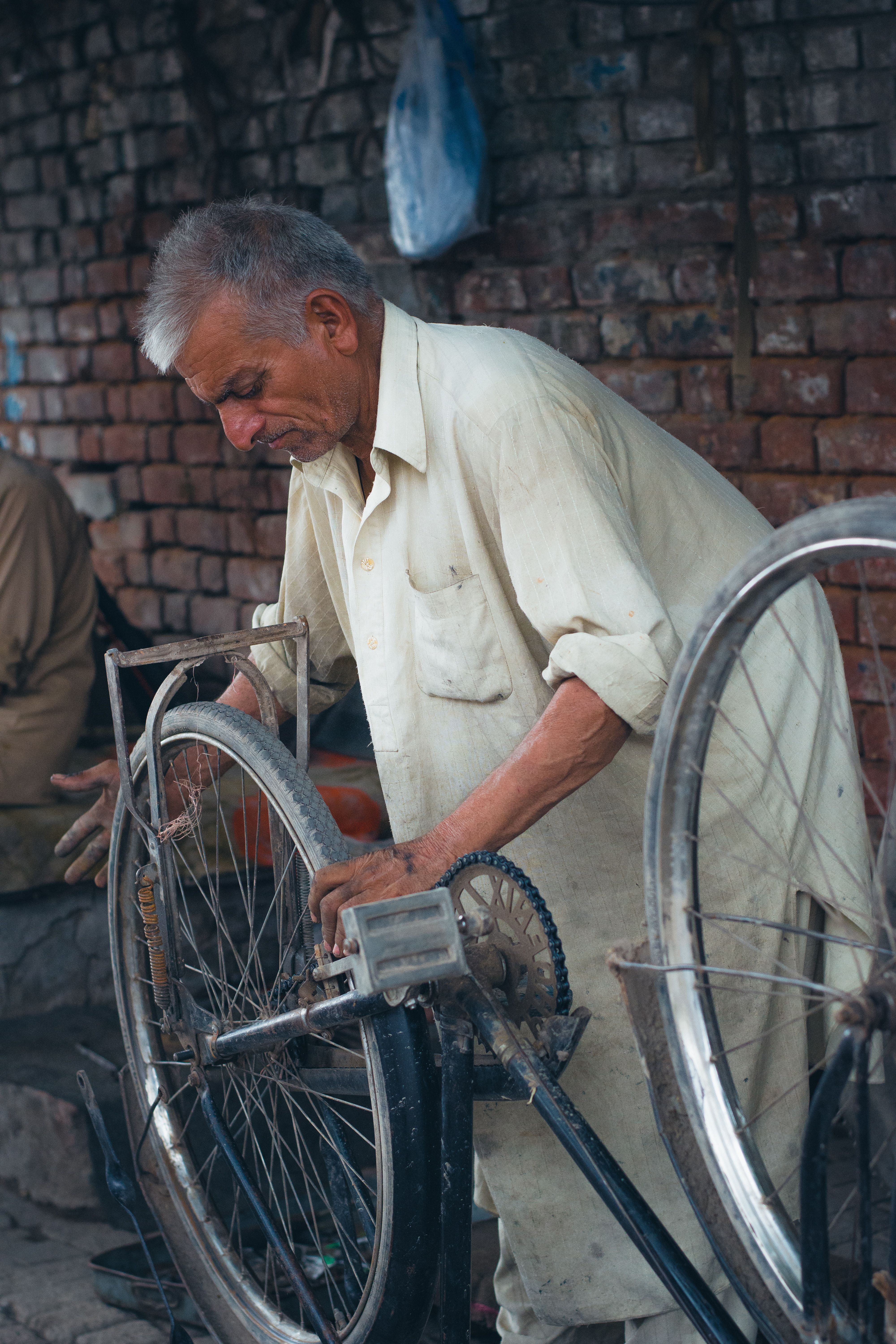 Man Repairing Bike · Free Stock Photo