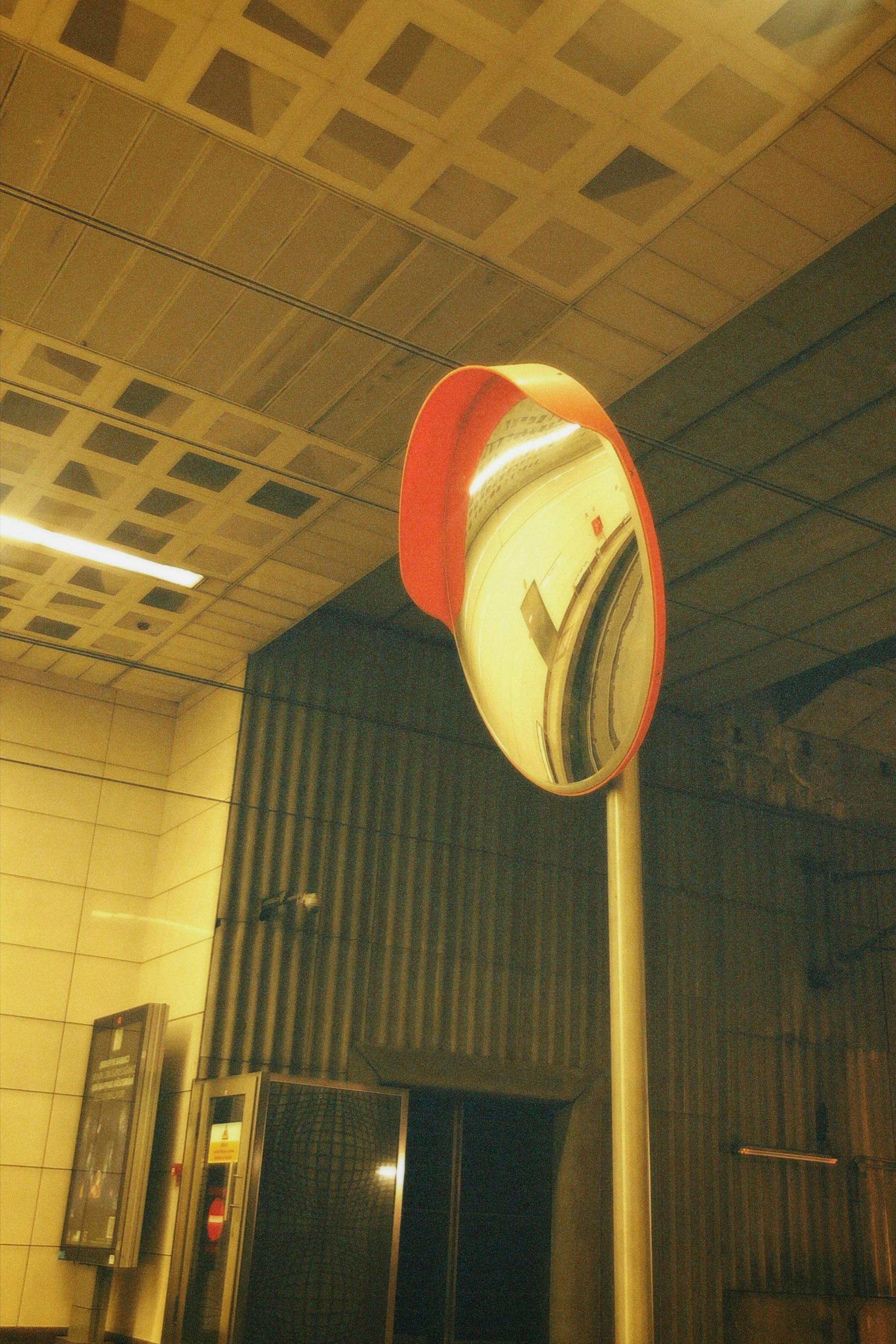 Security Mirror on Pole Installed in Subway Station · Free Stock Photo