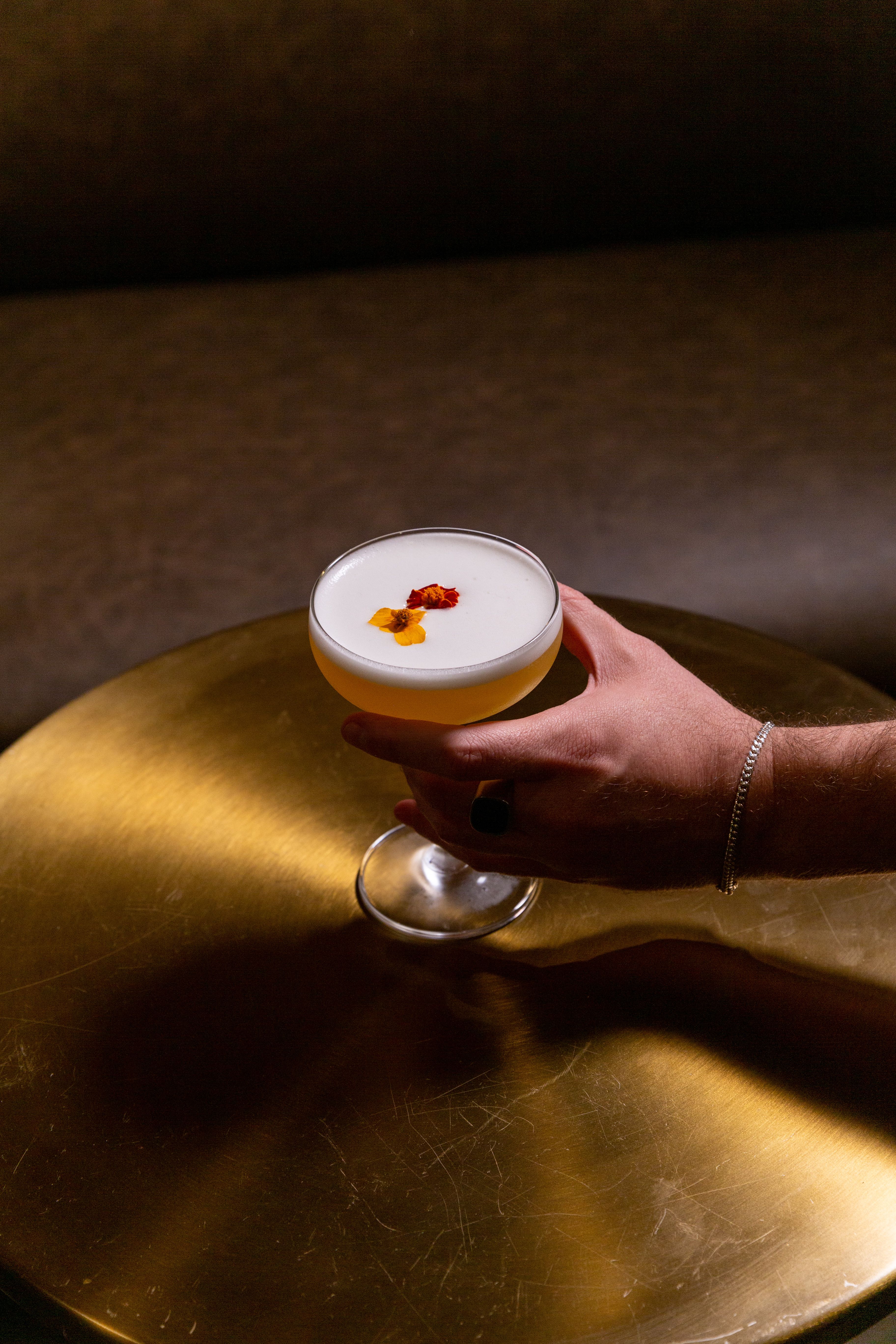 A Person Taking a Glass of Martini Cocktail from a Round Shiny Metal ...
