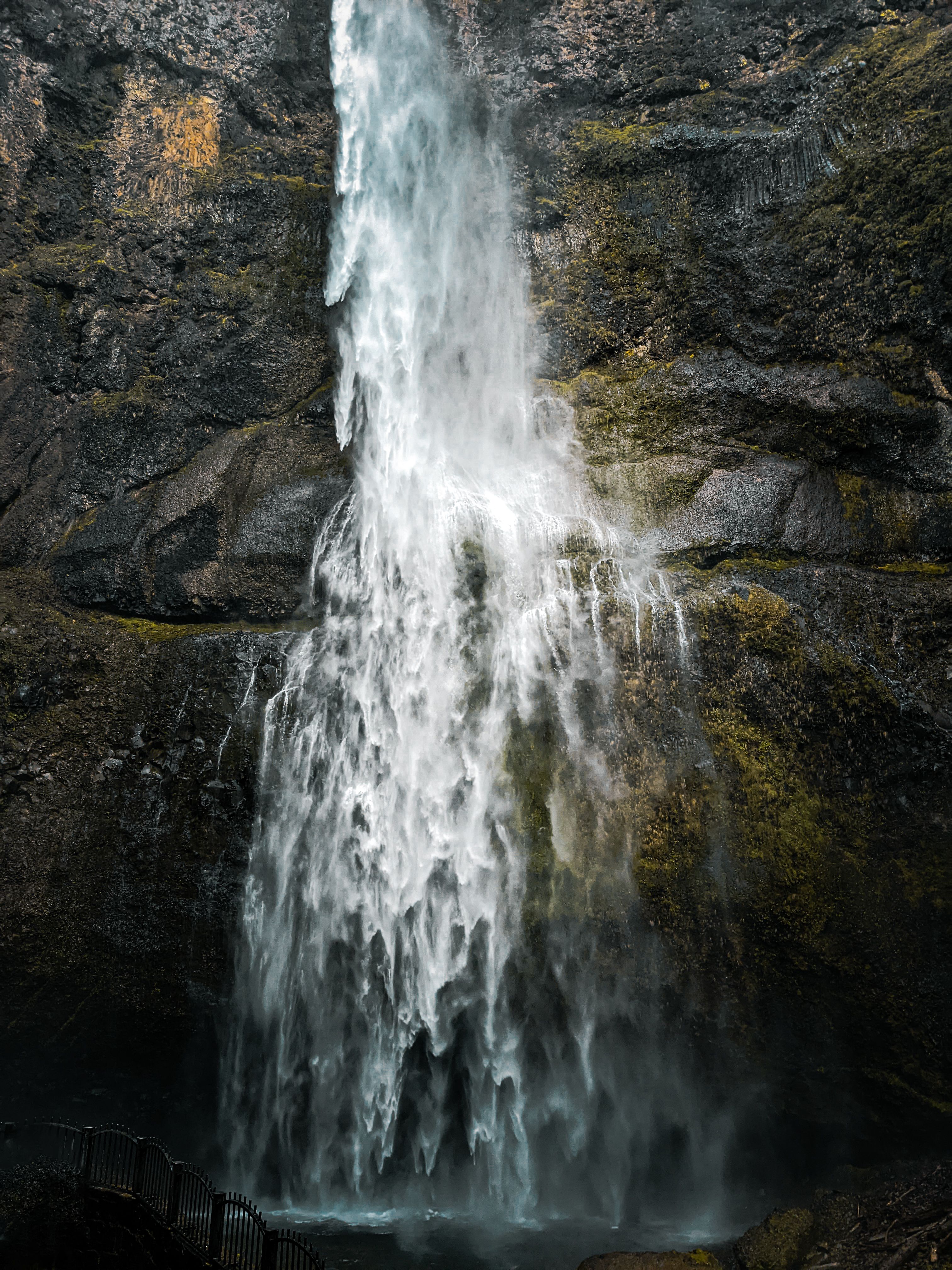 Water Falls in Brown Brick Walled Building · Free Stock Photo