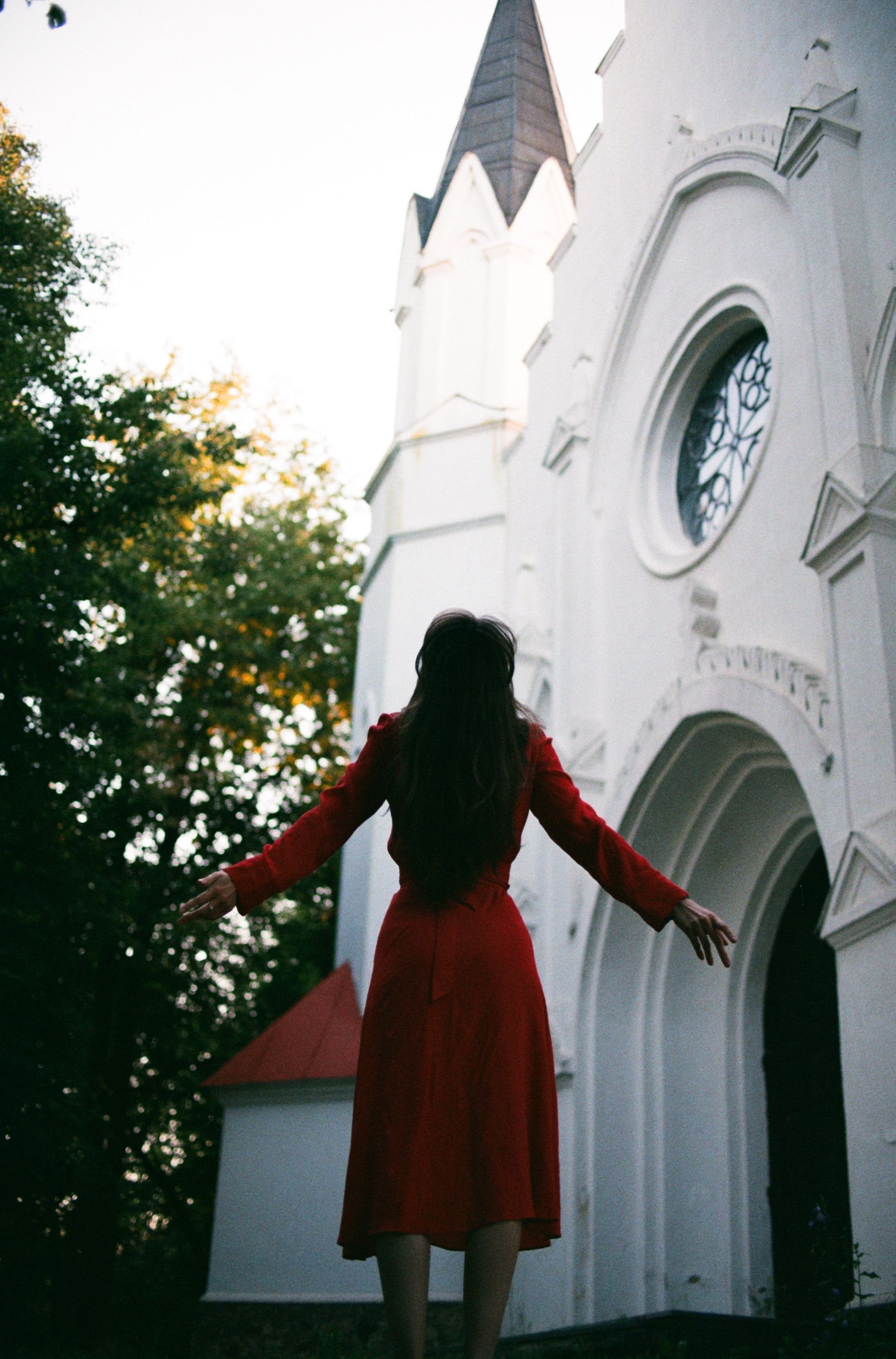 Woman in Front of a Church · Free Stock Photo