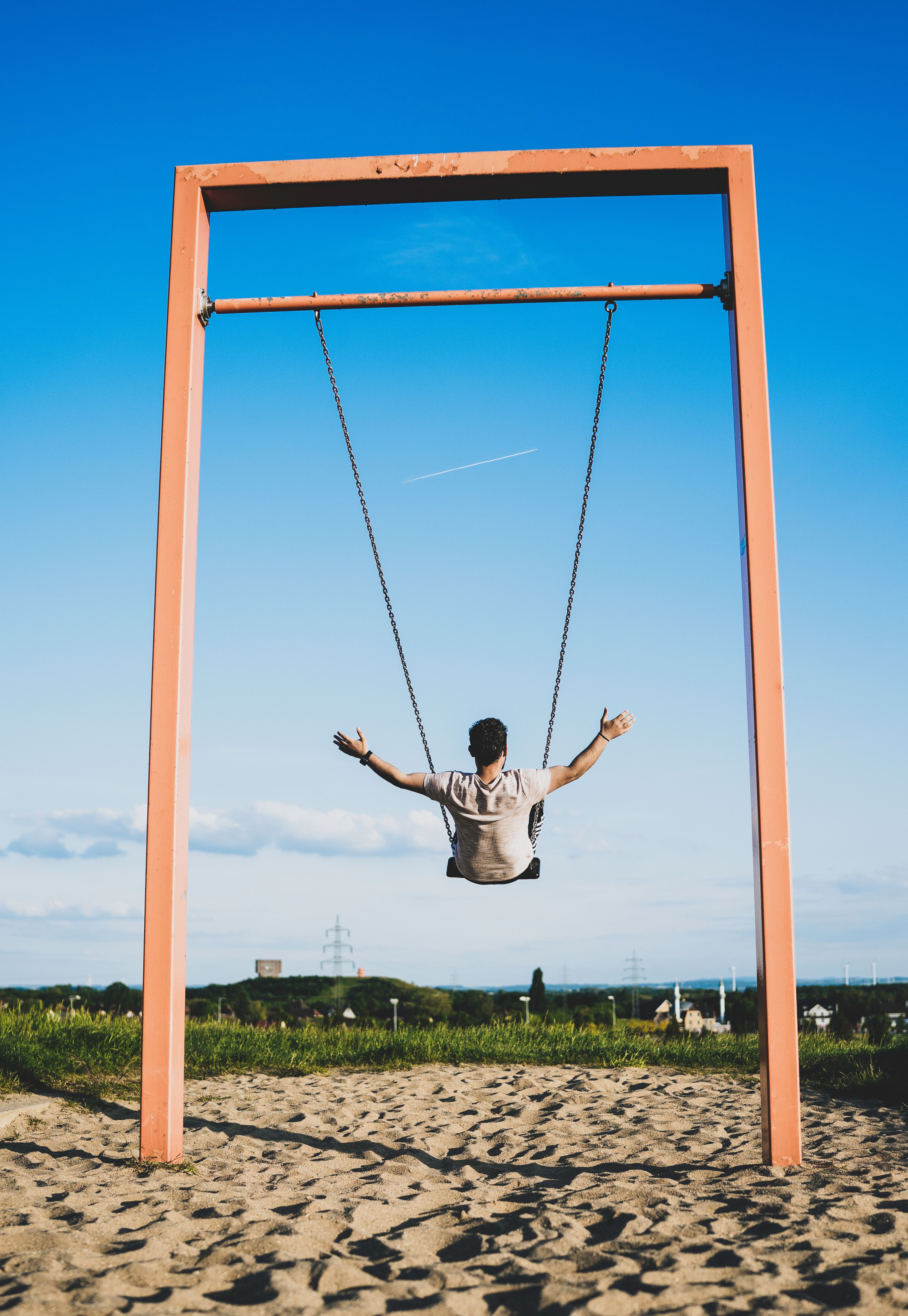 Man Swining on Swing over Sand · Free Stock Photo