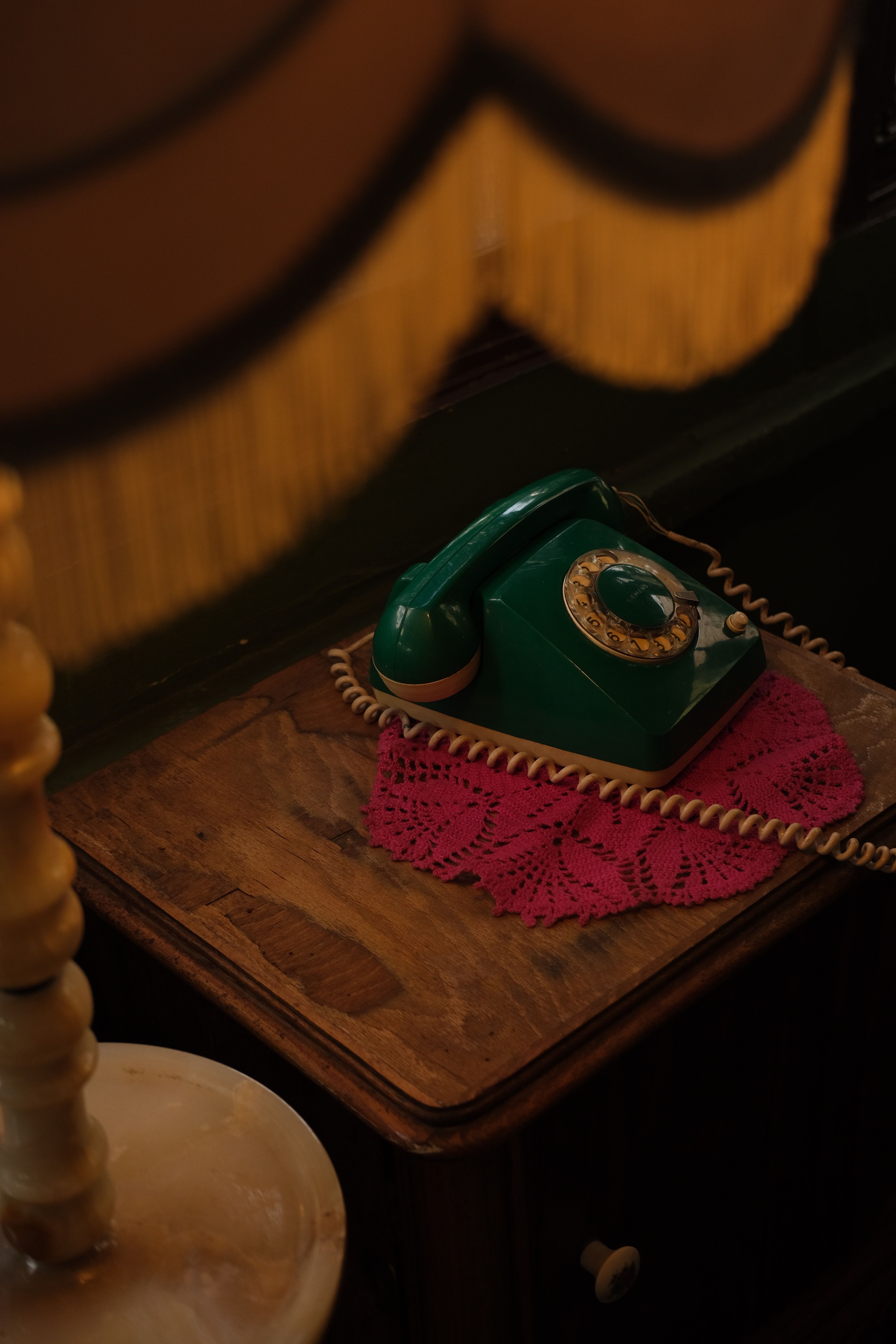 Vintage Green Telephone on Wooden Furniture · Free Stock Photo