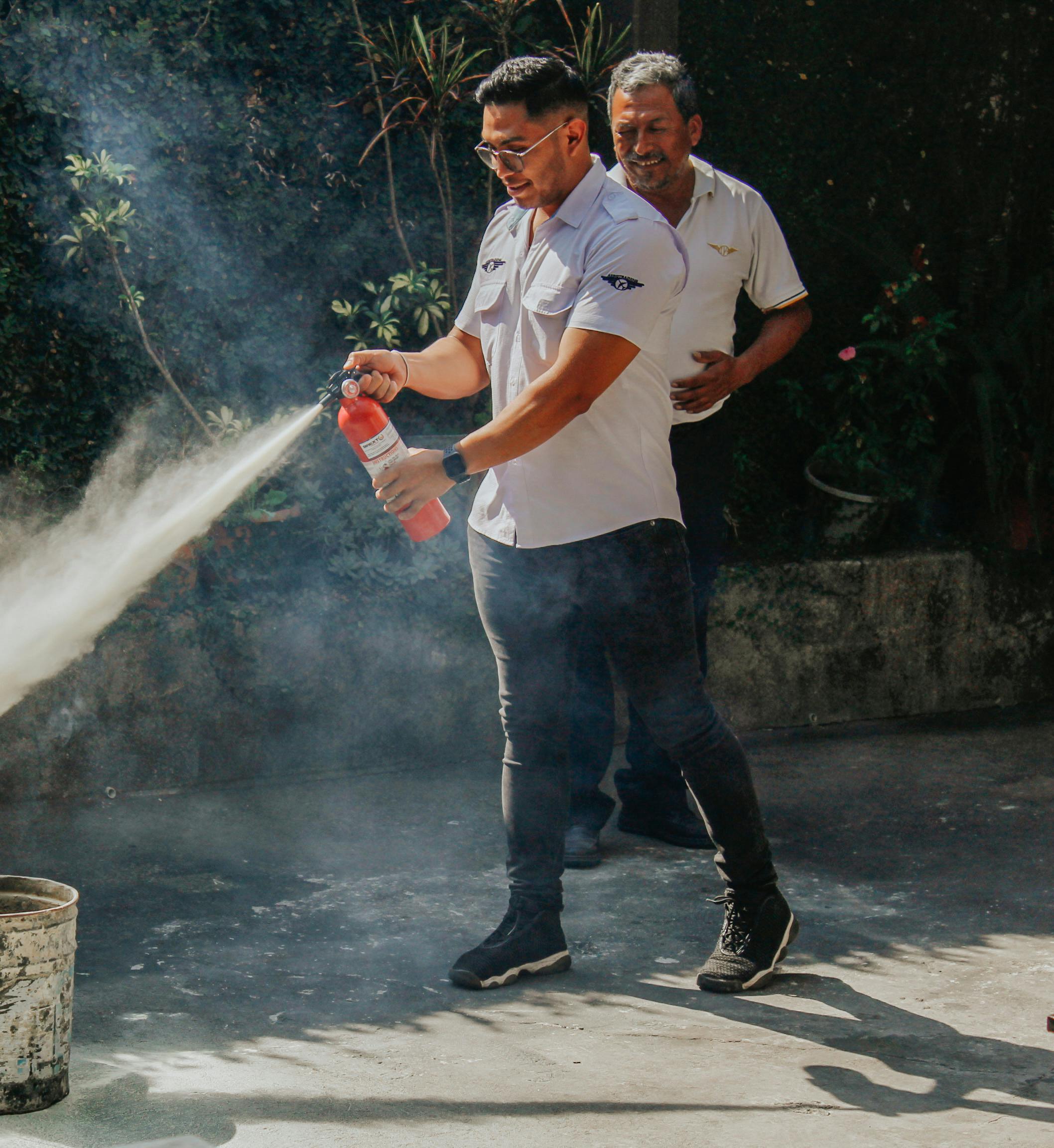 Men with Fire Extinguisher · Free Stock Photo