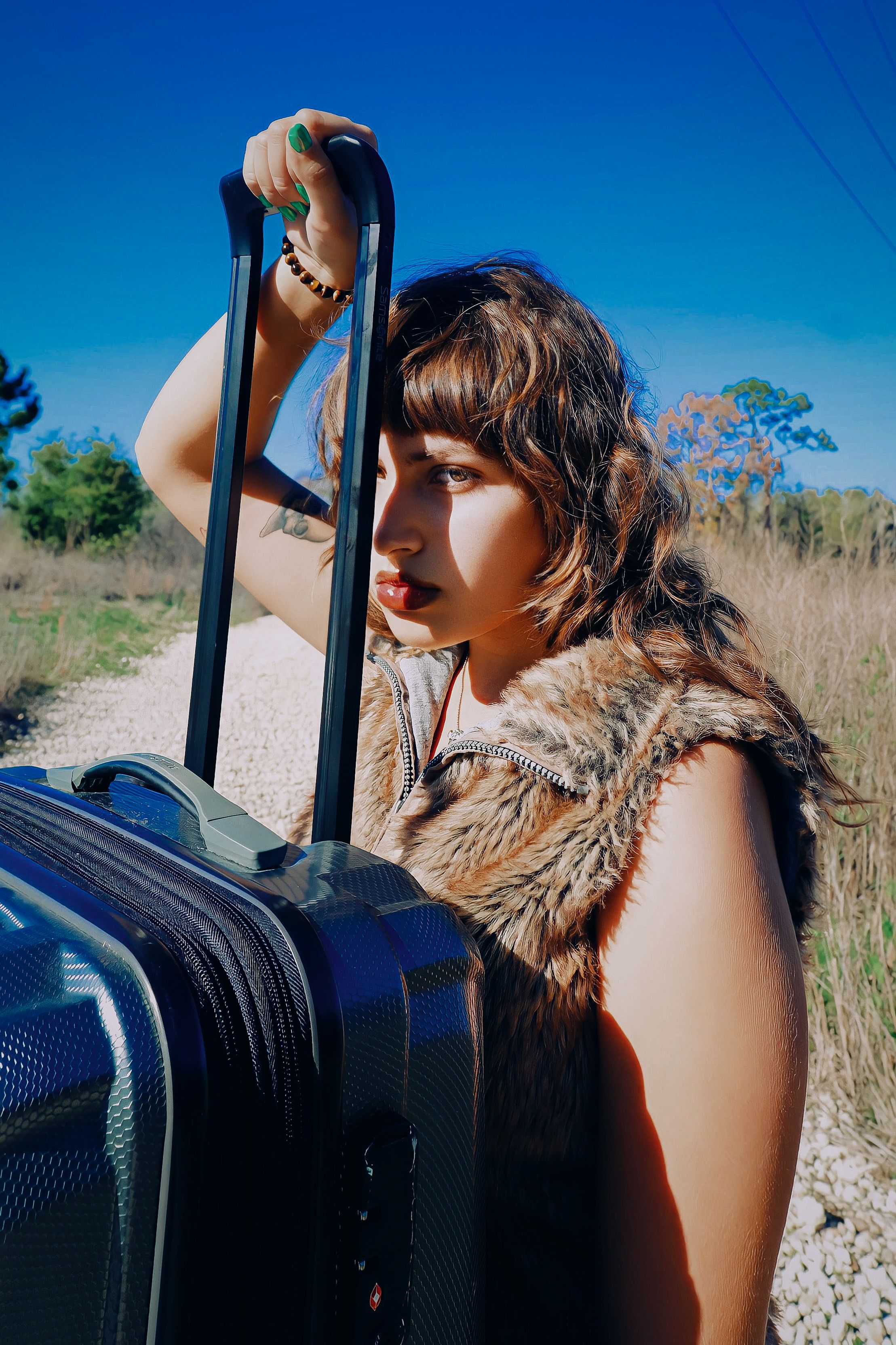 Woman Posing with Suitcase · Free Stock Photo