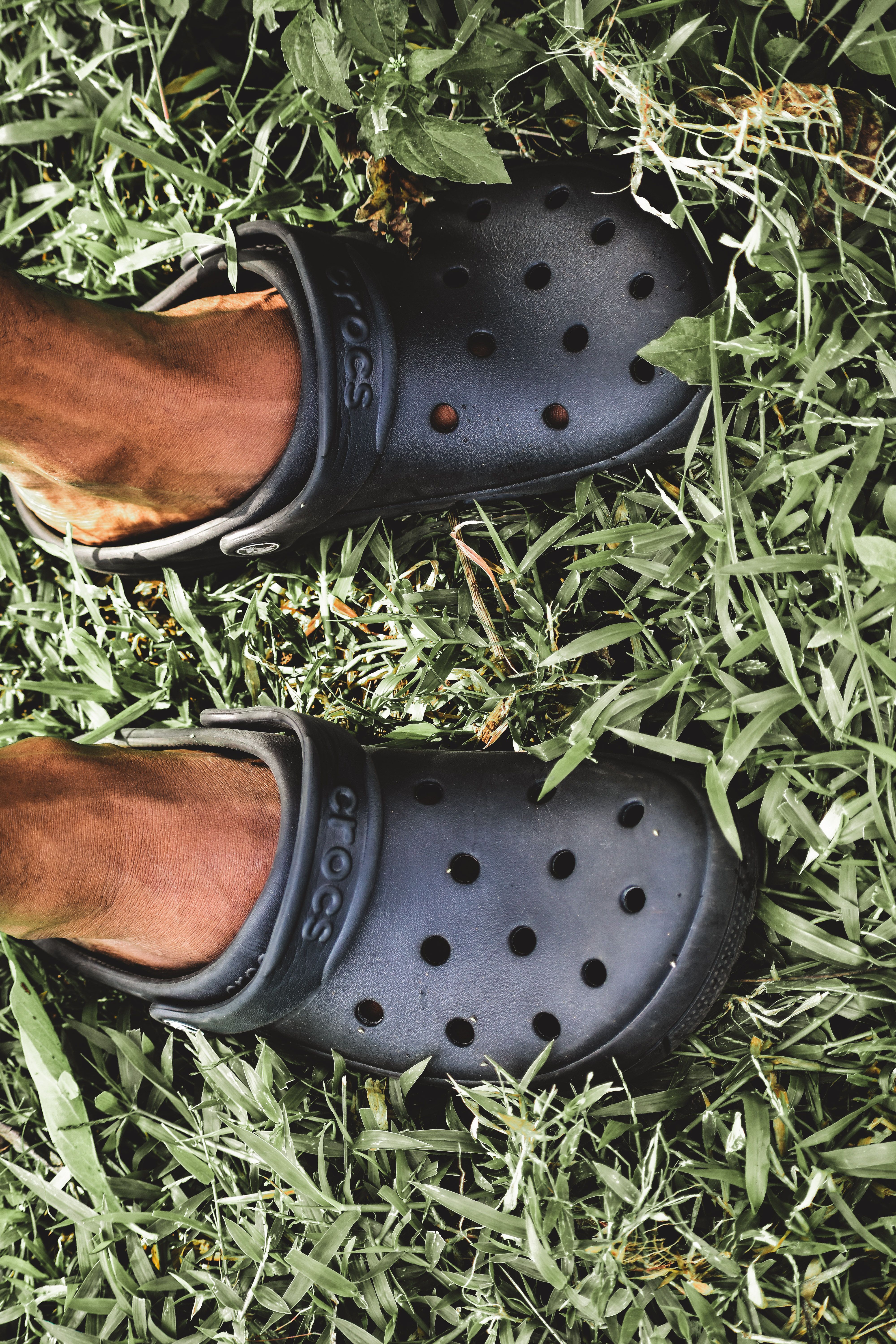 Person Wearing Black Crocs · Free Stock Photo