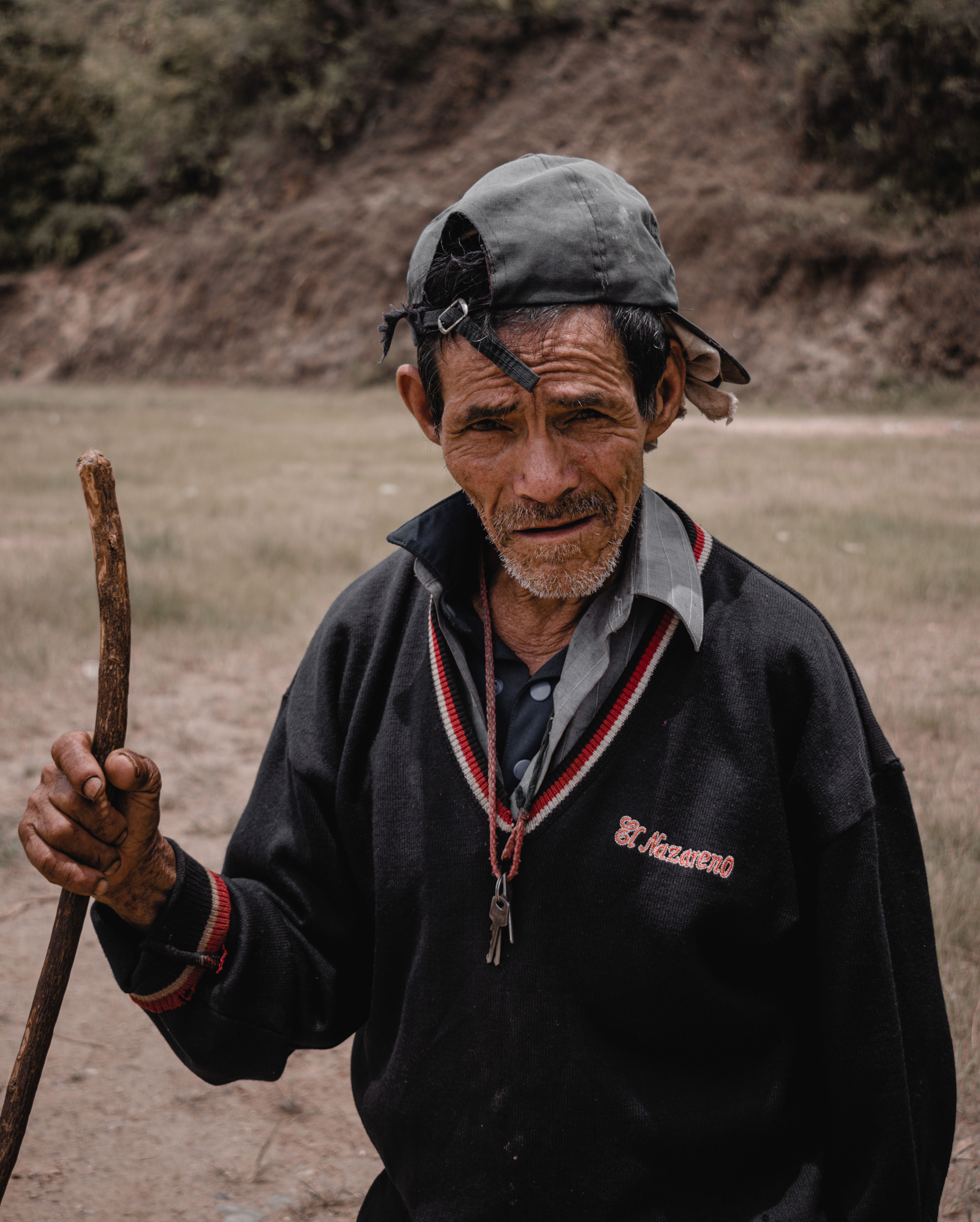 Elderly Man with a Stick Wearing a Baseball Cap backwards · Free Stock ...