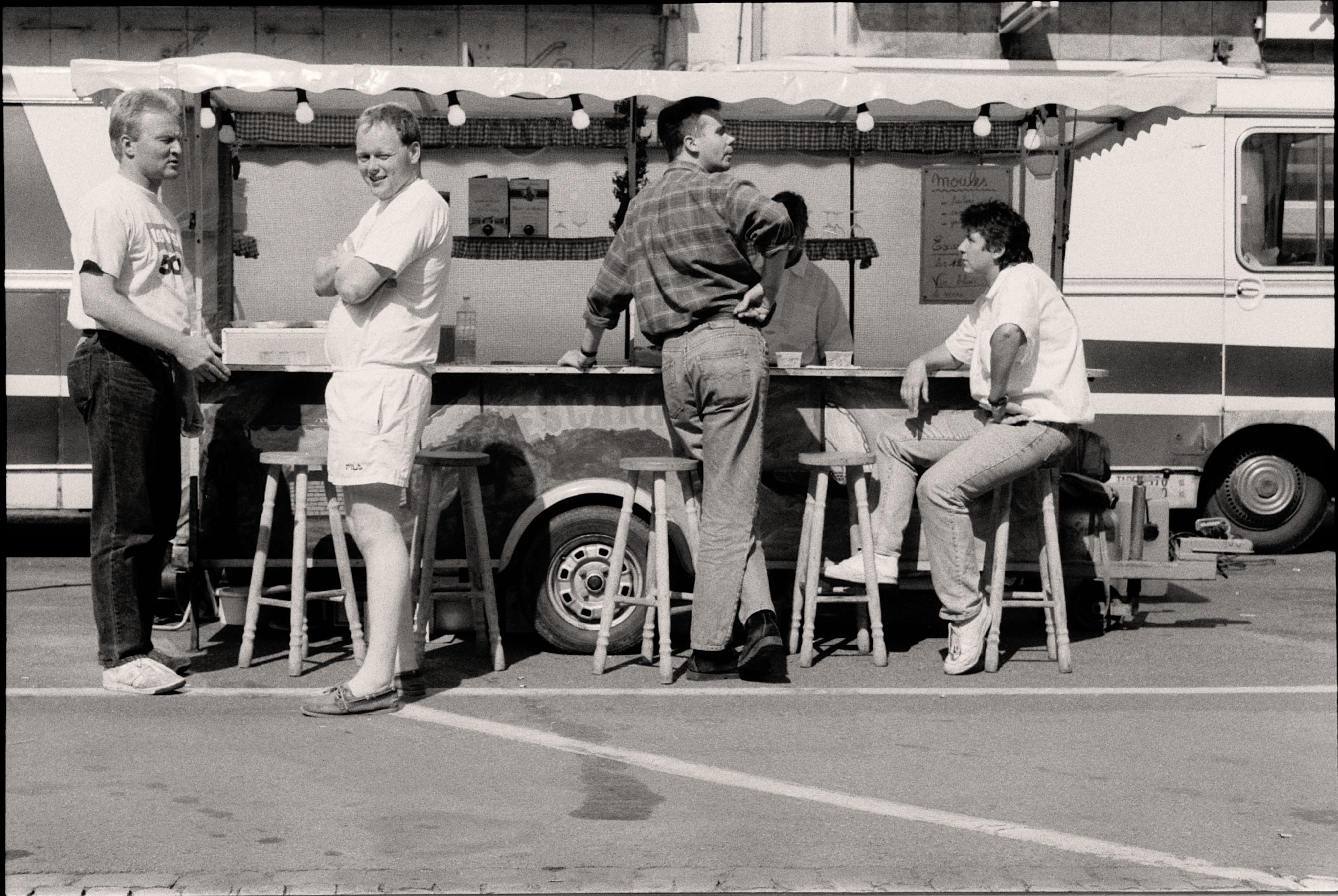 Men Standing by Food Stand · Free Stock Photo