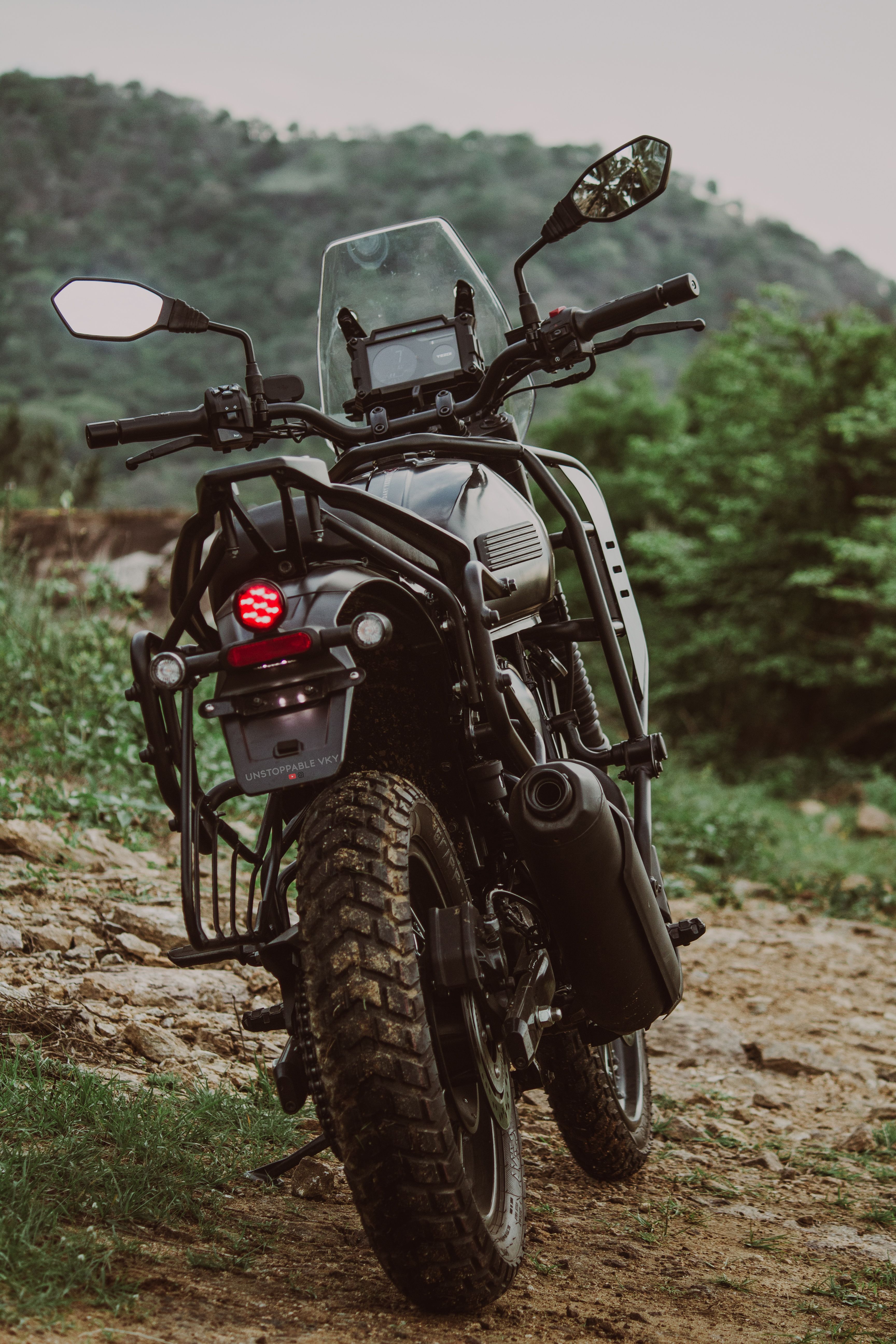 A Motorcycle Parked on a Hill · Free Stock Photo
