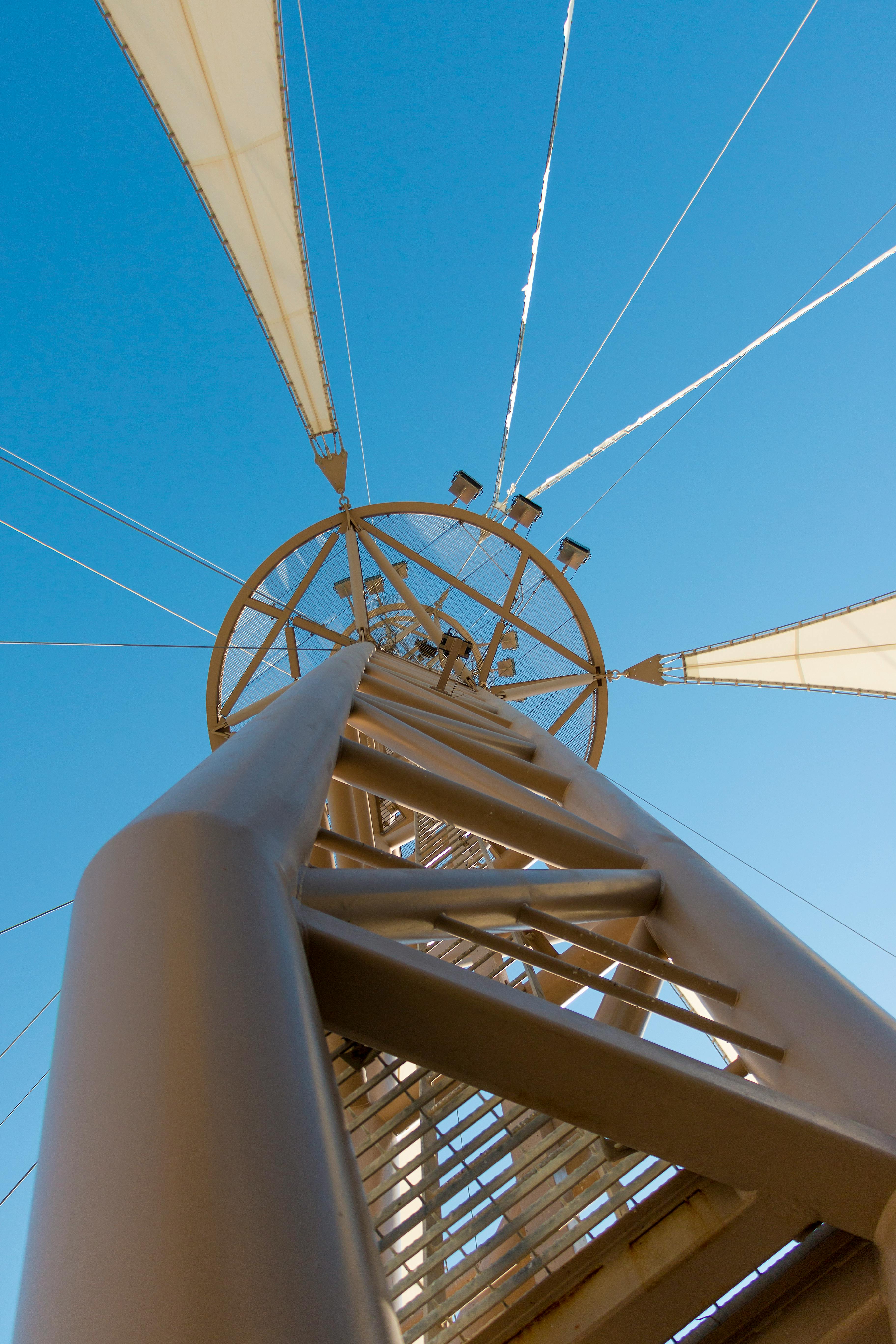 Low Angle Shot of a Tower with Wires · Free Stock Photo