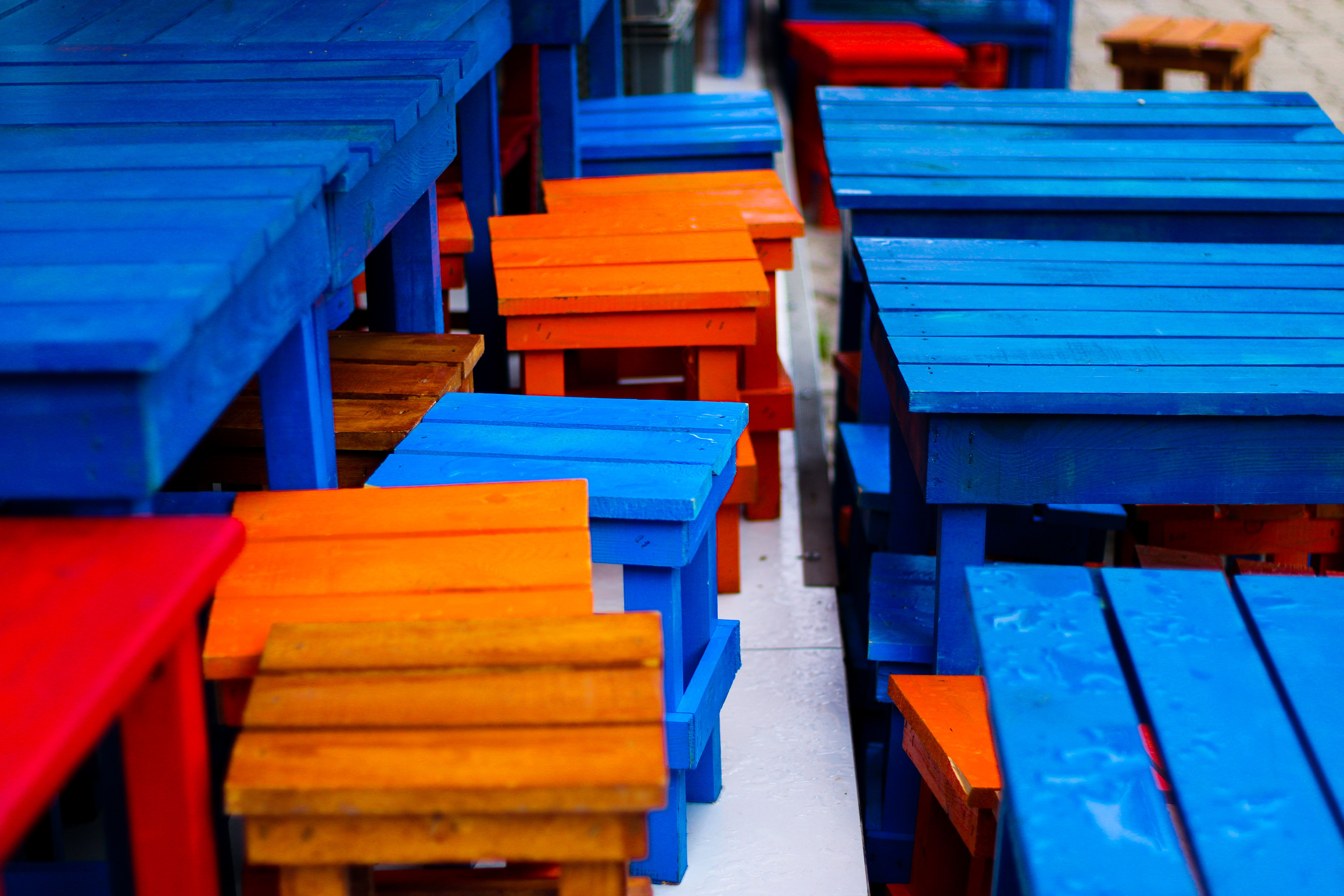 Close-up of Colorful, Wooden Tables and Chairs · Free Stock Photo