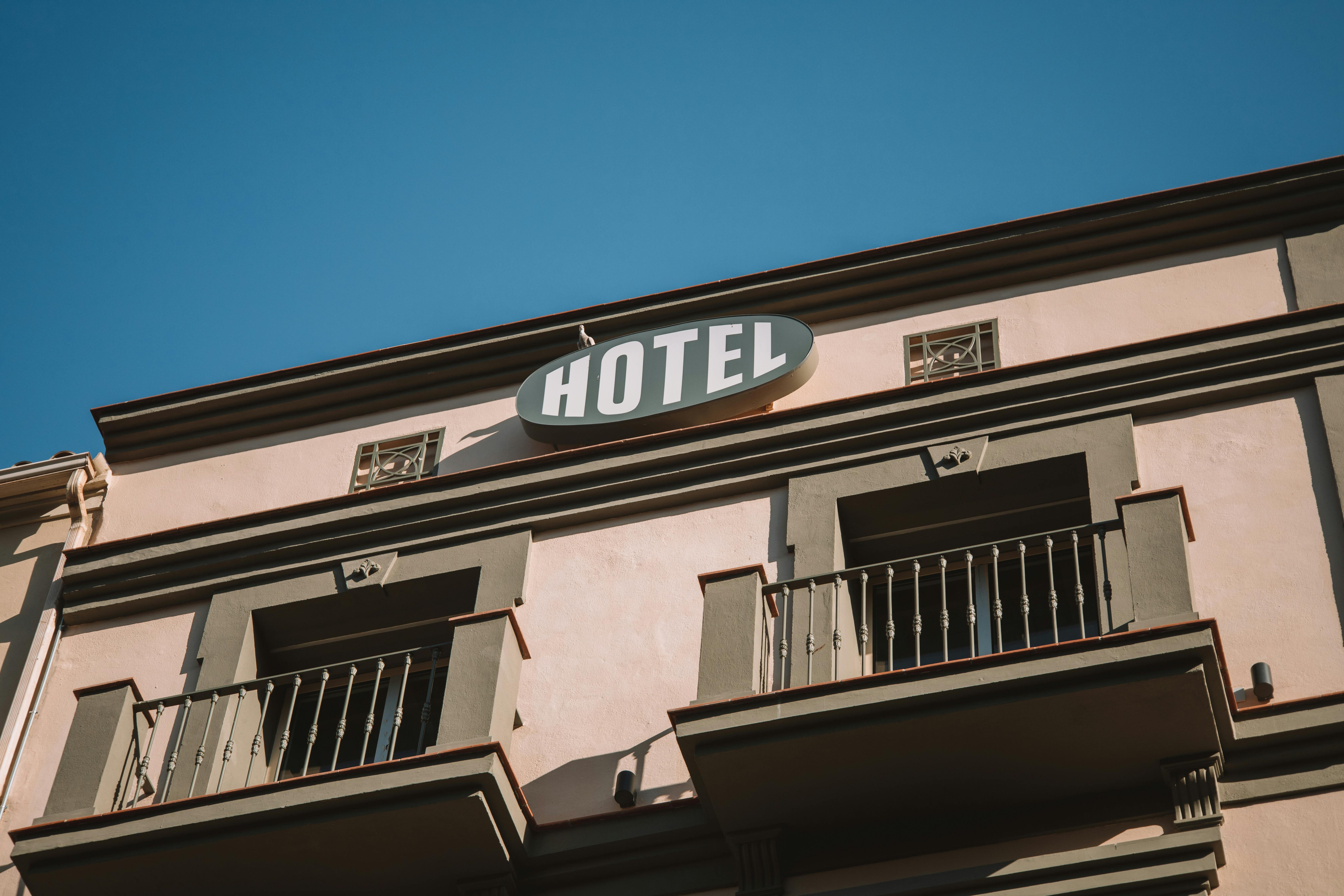 Hotel Sign on Building Facade · Free Stock Photo