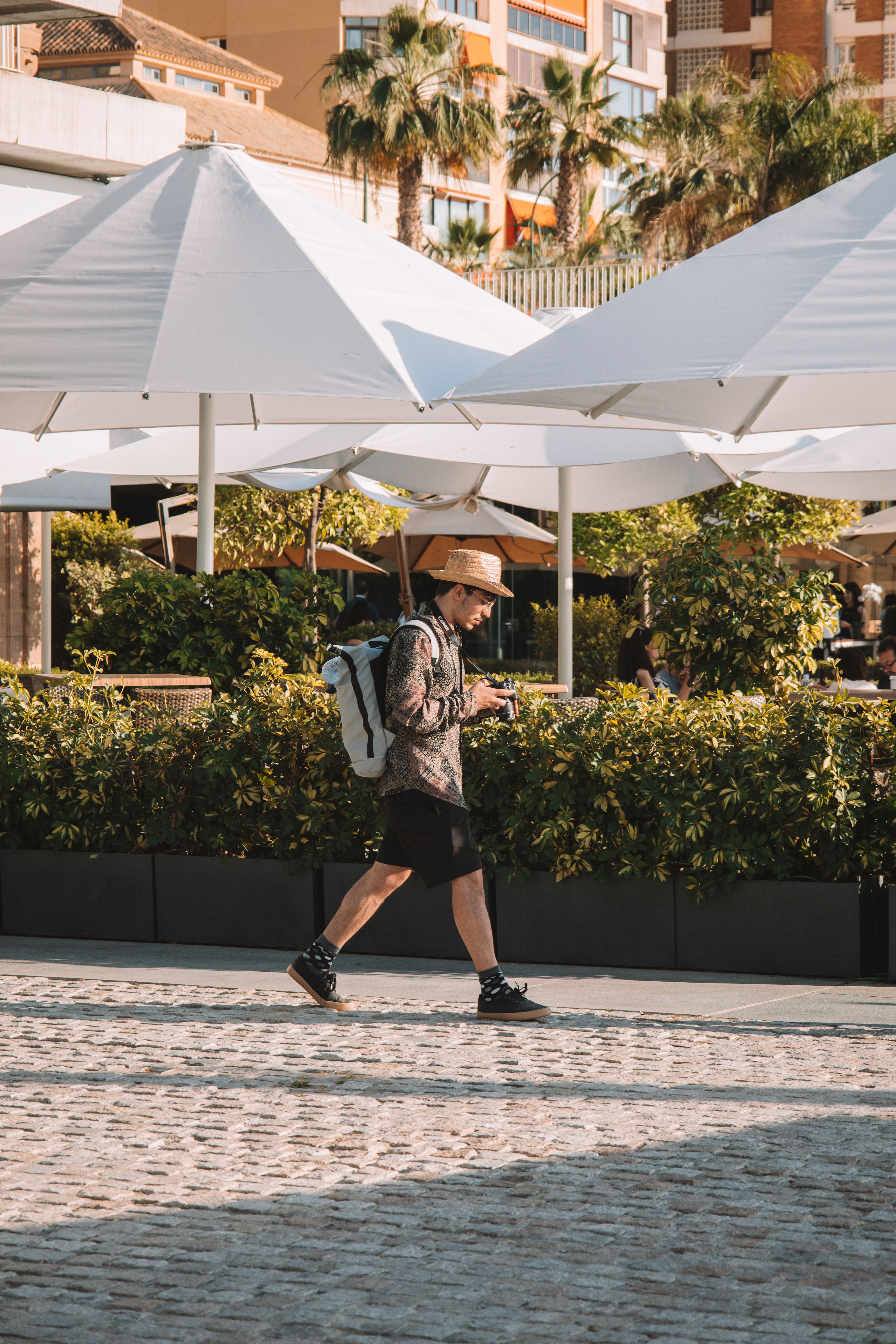 Man Walking on Pavement · Free Stock Photo