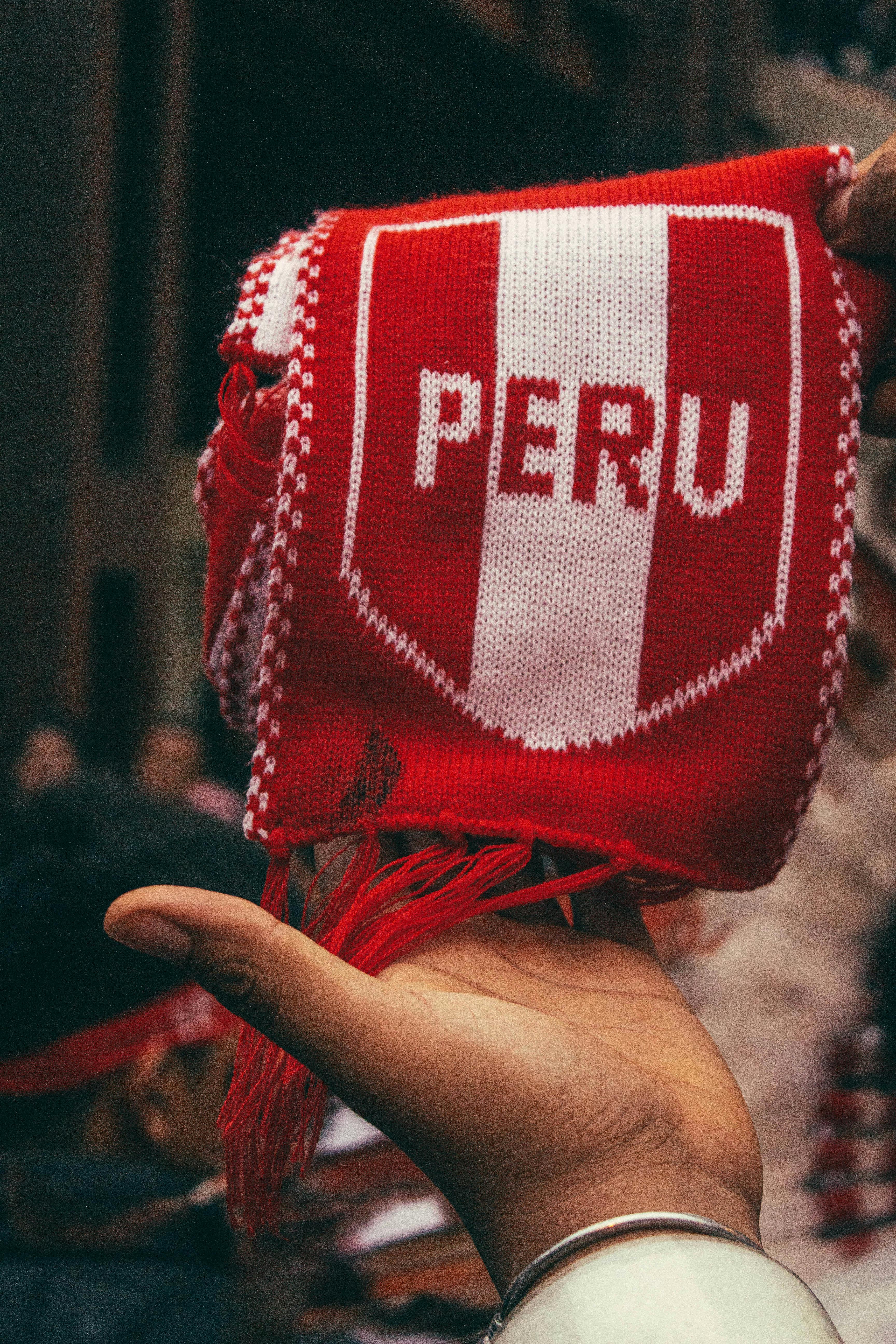 Hand Holding National Peru Football Team Scarf · Free Stock Photo
