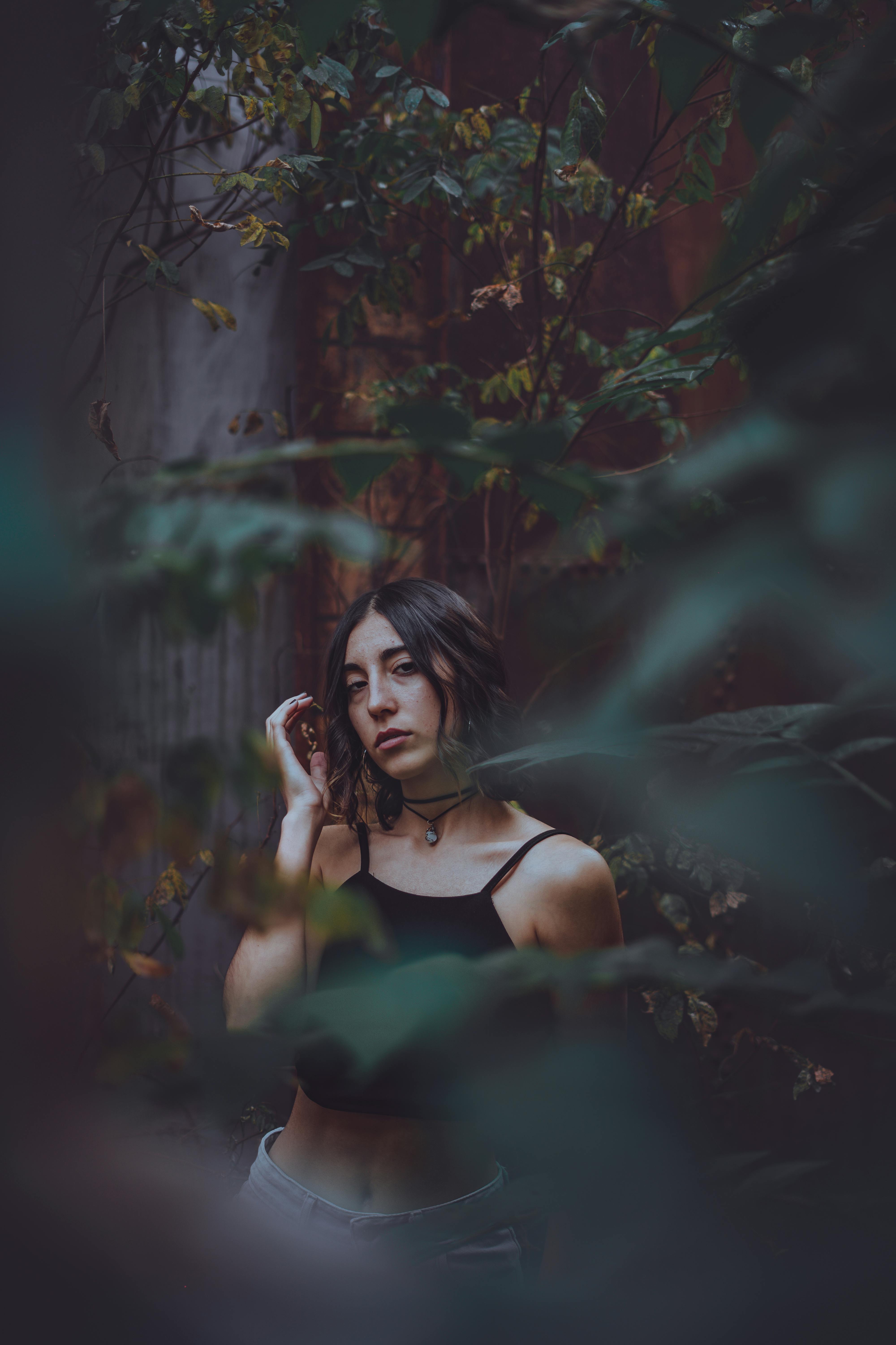 Woman in Jeans and Black Crop Top among Trees · Free Stock Photo