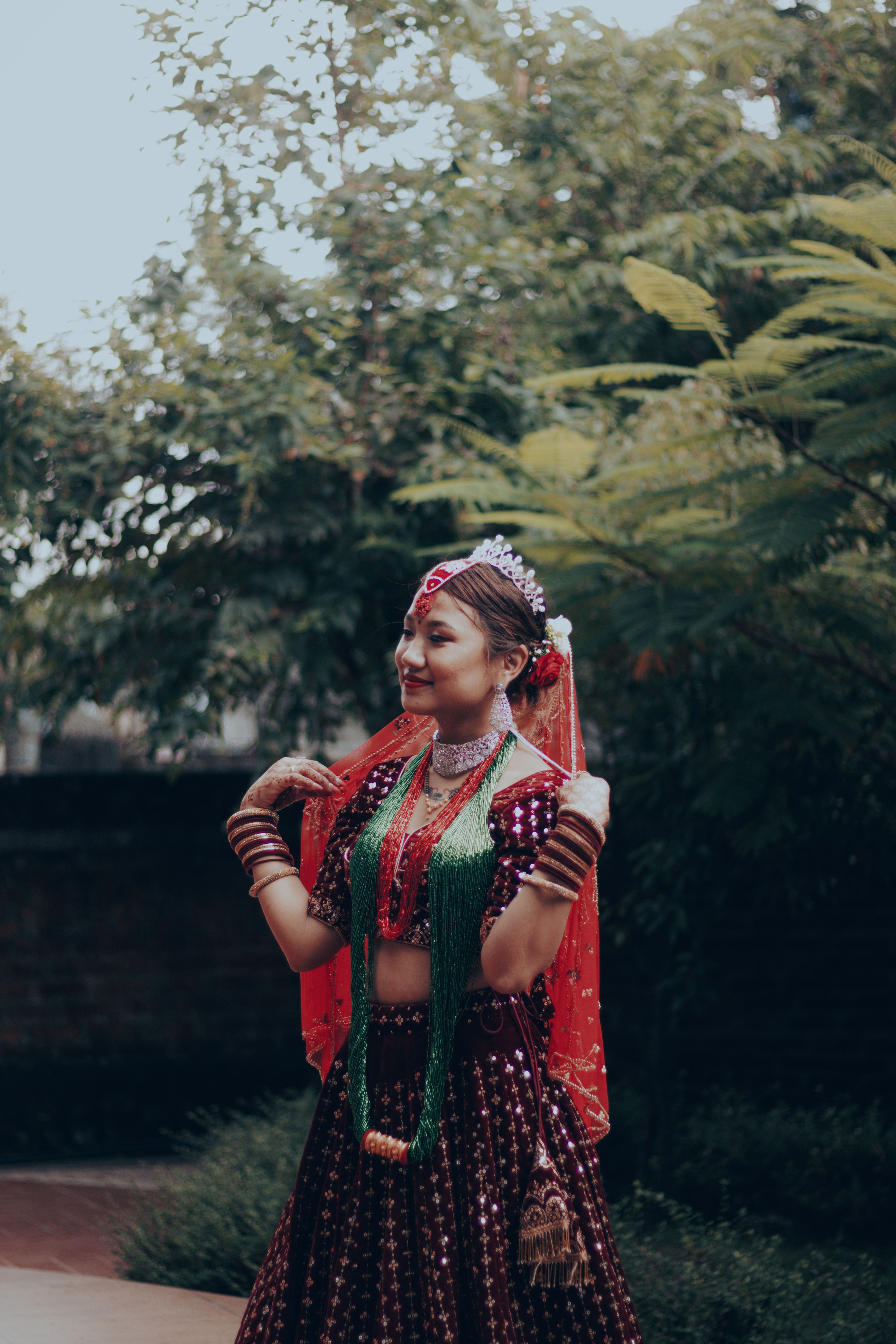 Woman Standing and Posing in Traditional Clothing · Free Stock Photo