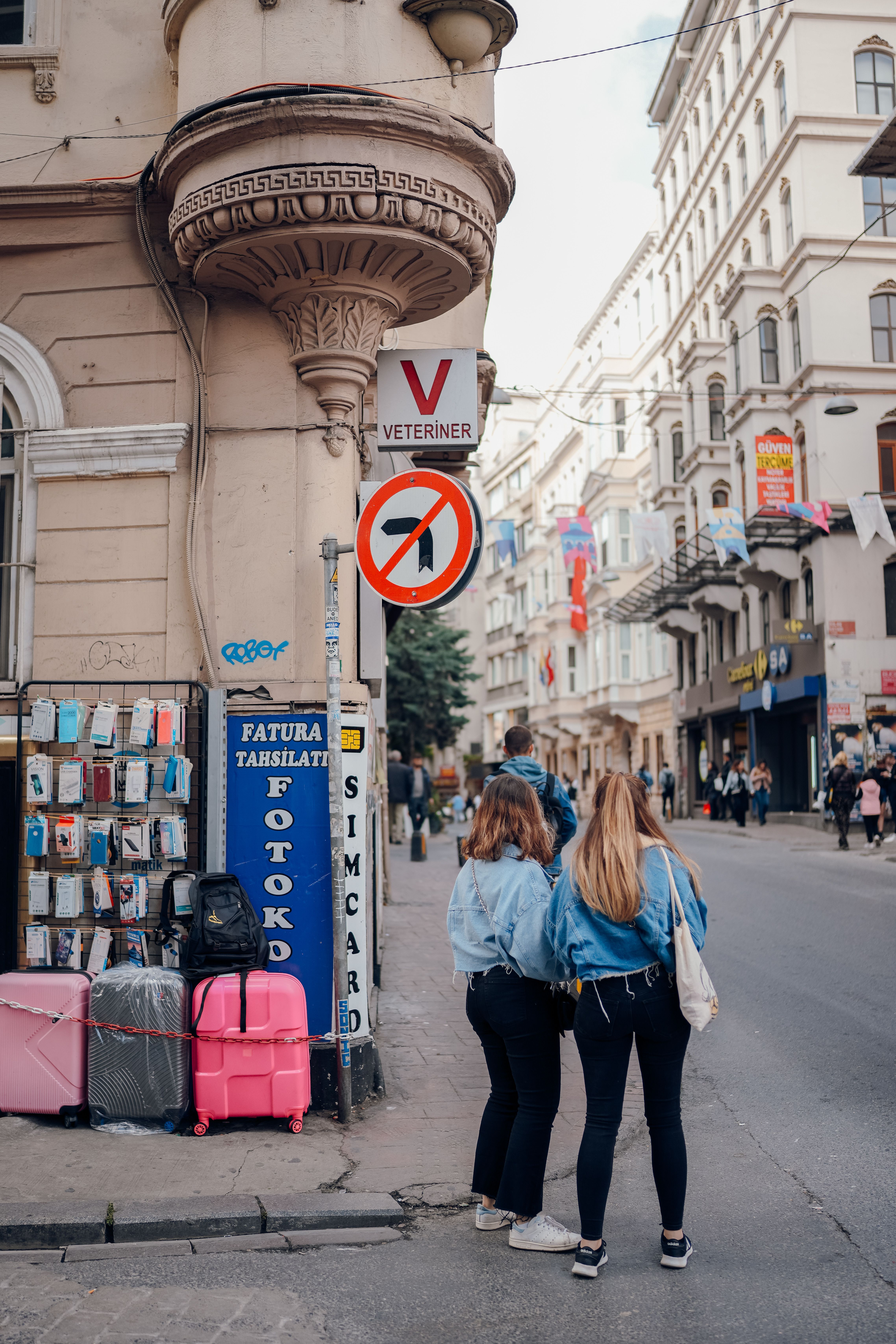 Girls Standing on the Corner of the Street · Free Stock Photo