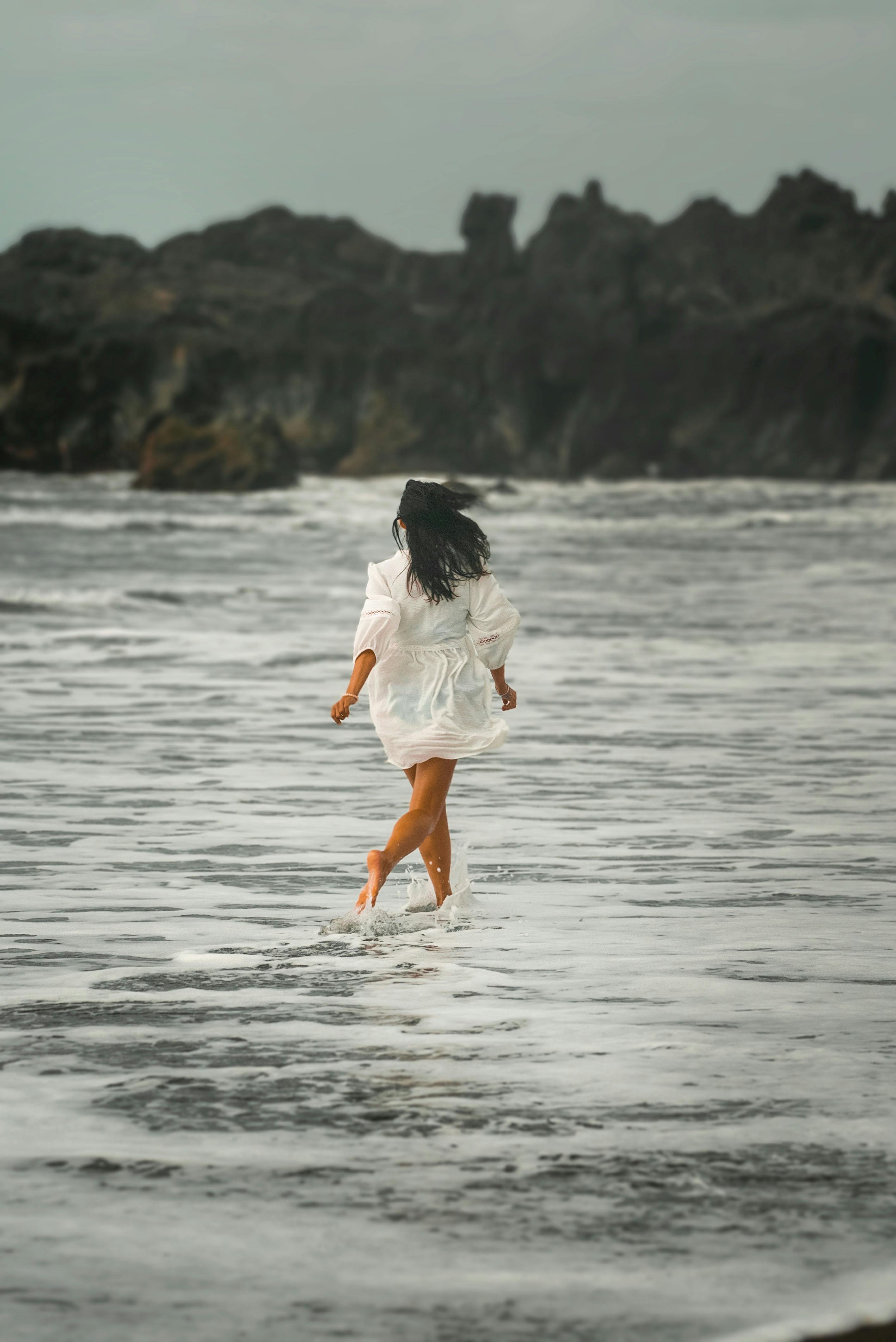 Woman in White Sundress Running in Ocean · Free Stock Photo