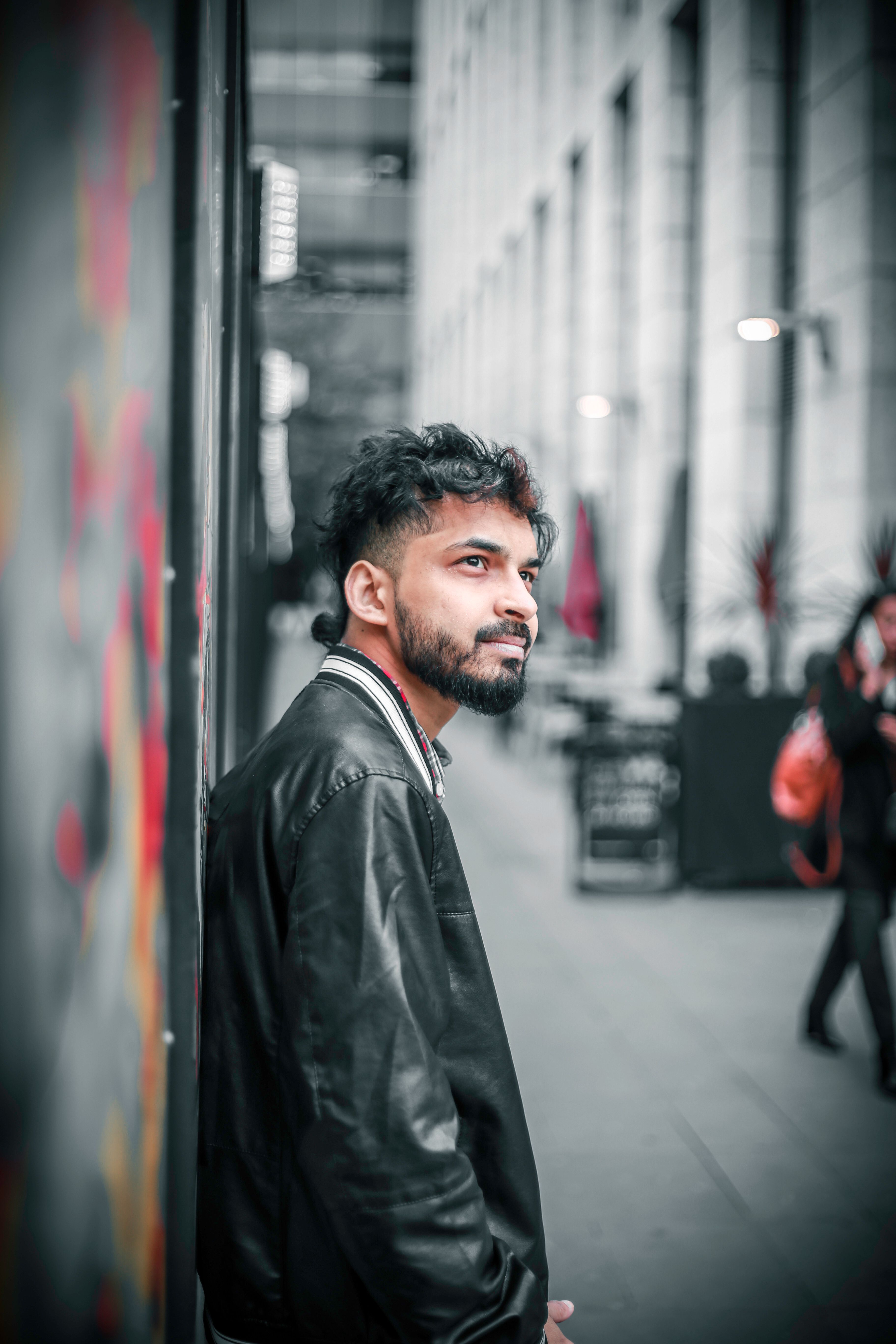 A Man Taking Off a Jacket · Free Stock Photo
