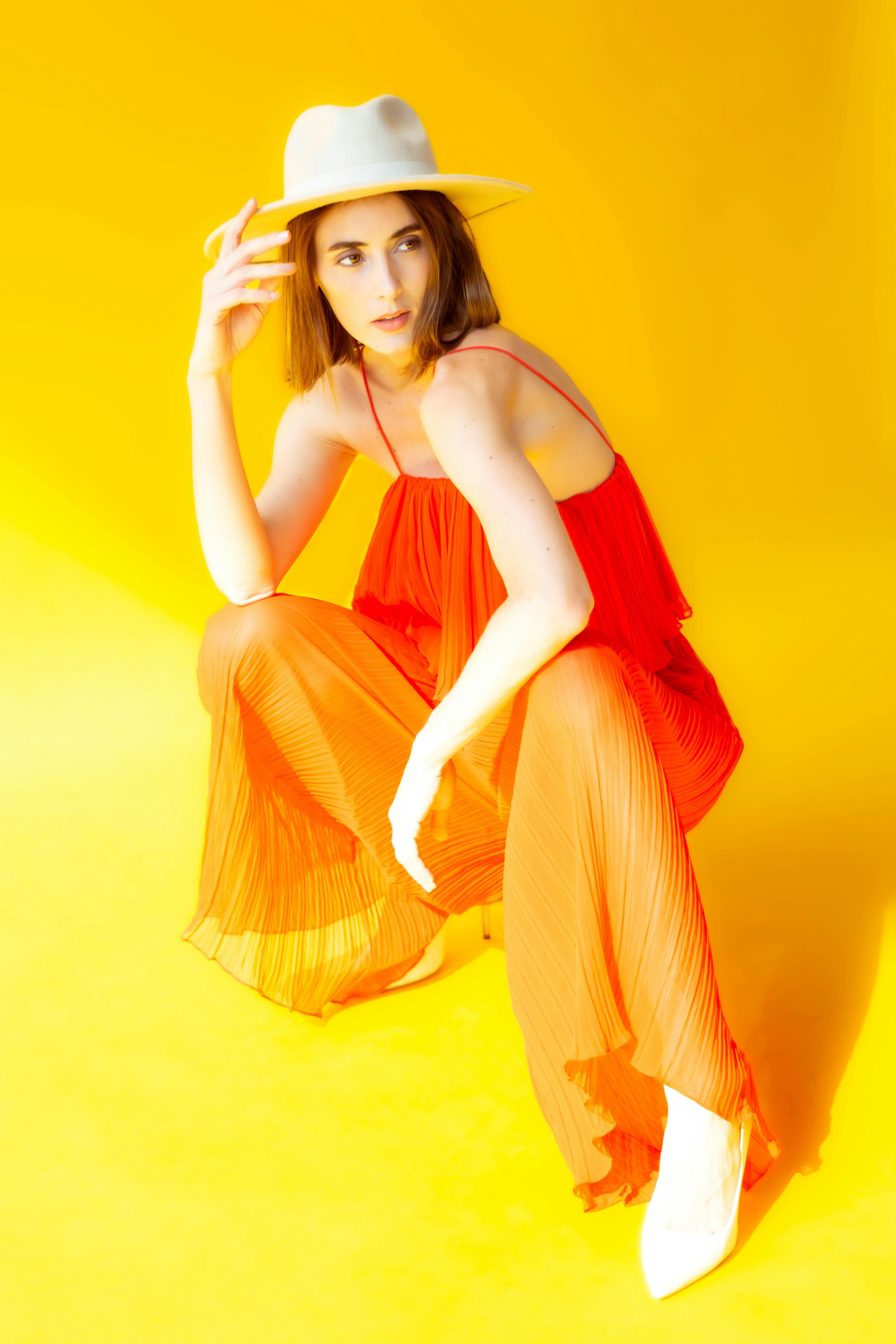 Woman Crouching and Posing · Free Stock Photo