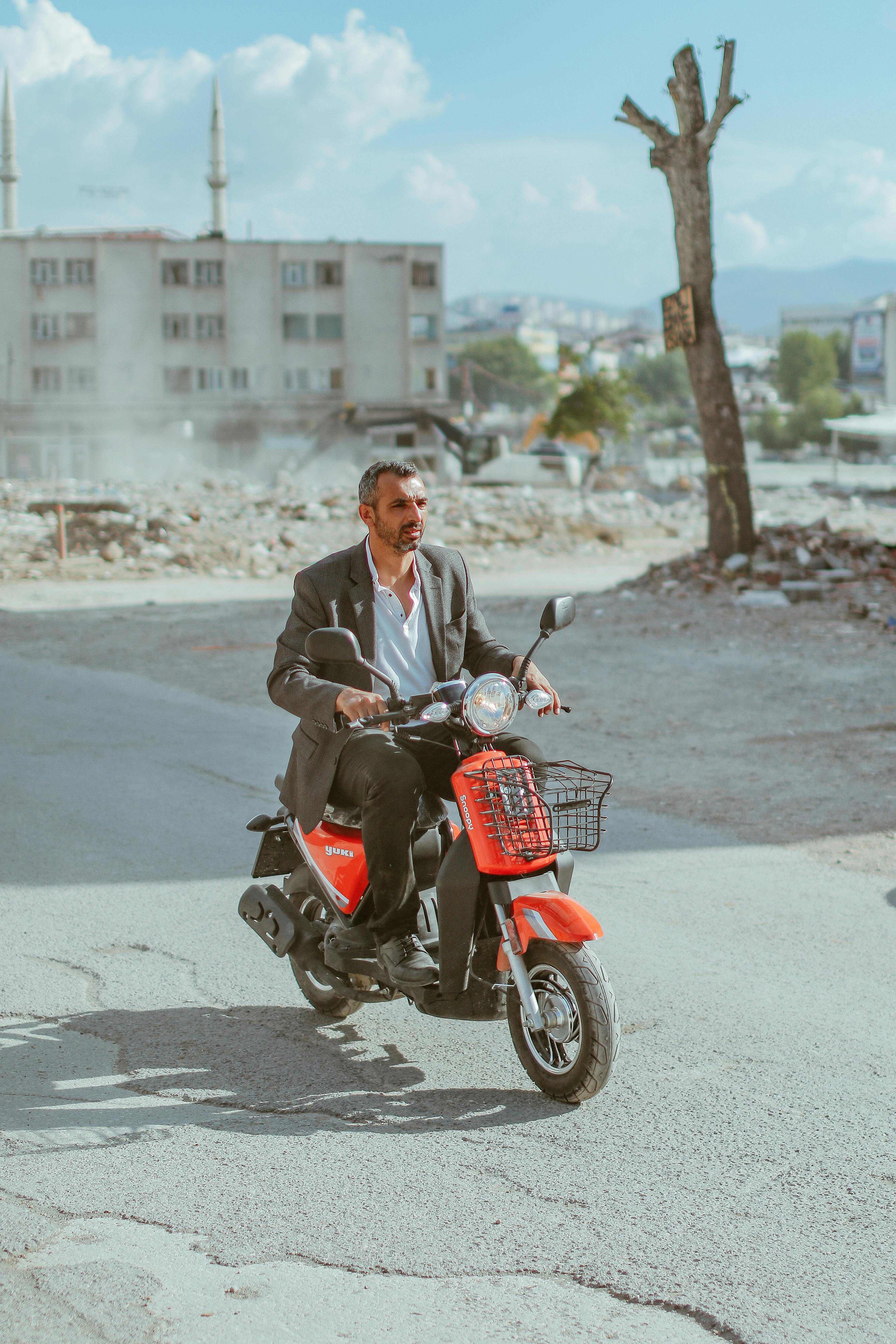 Man in Suit Riding Motorcycle on City Street · Free Stock Photo