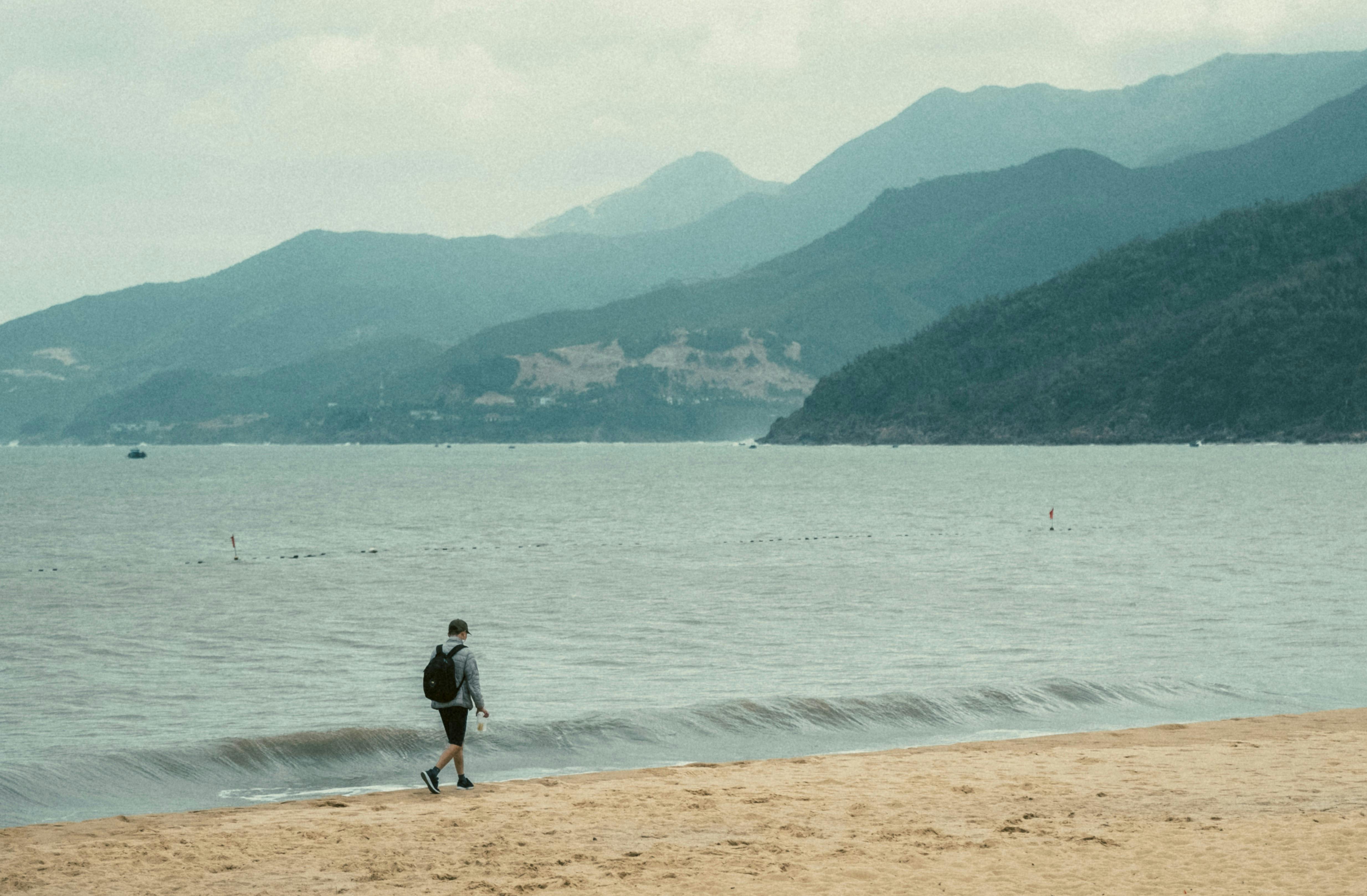 Backpacker at Beach · Free Stock Photo