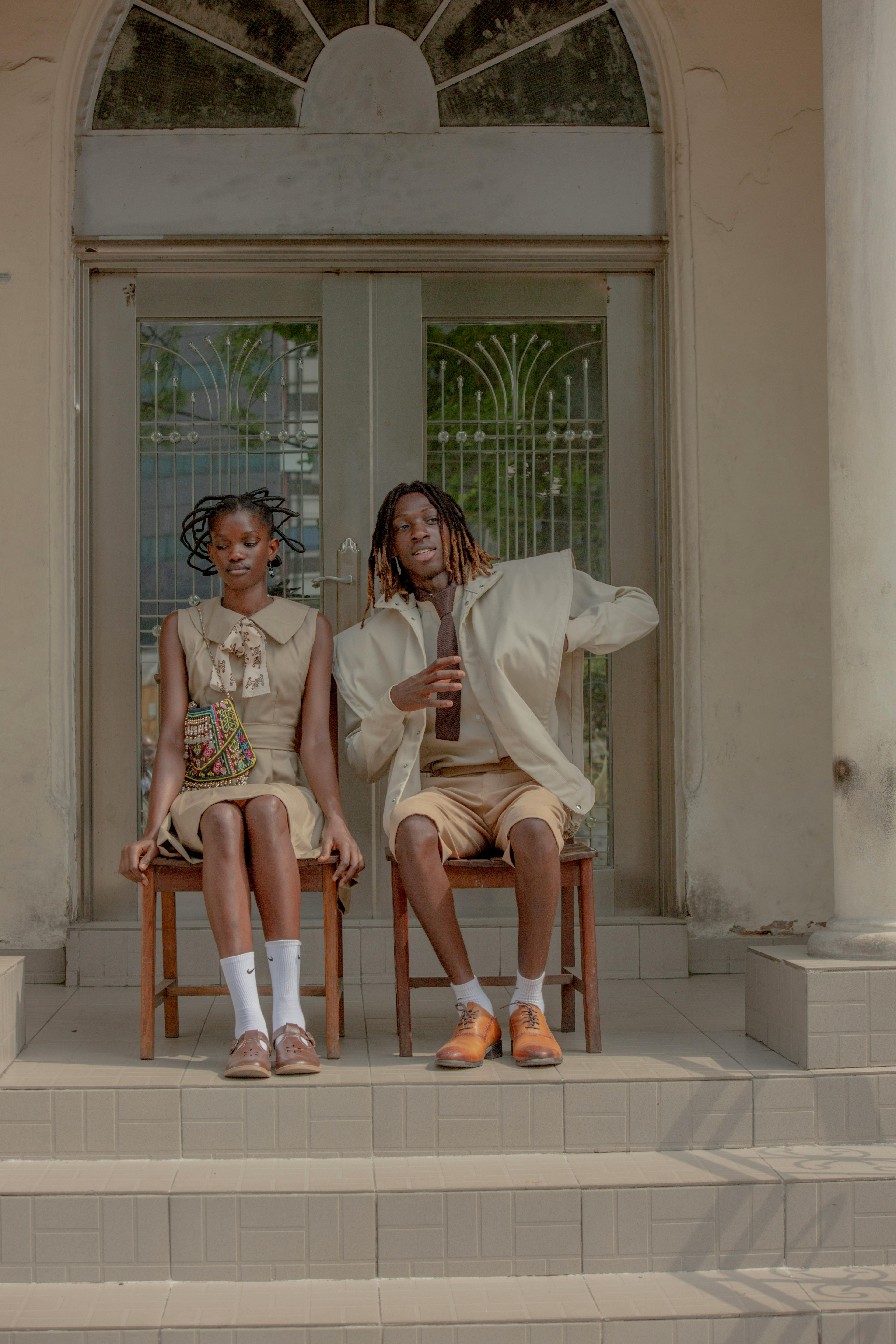 Models Posing in Sepia Clothing · Free Stock Photo