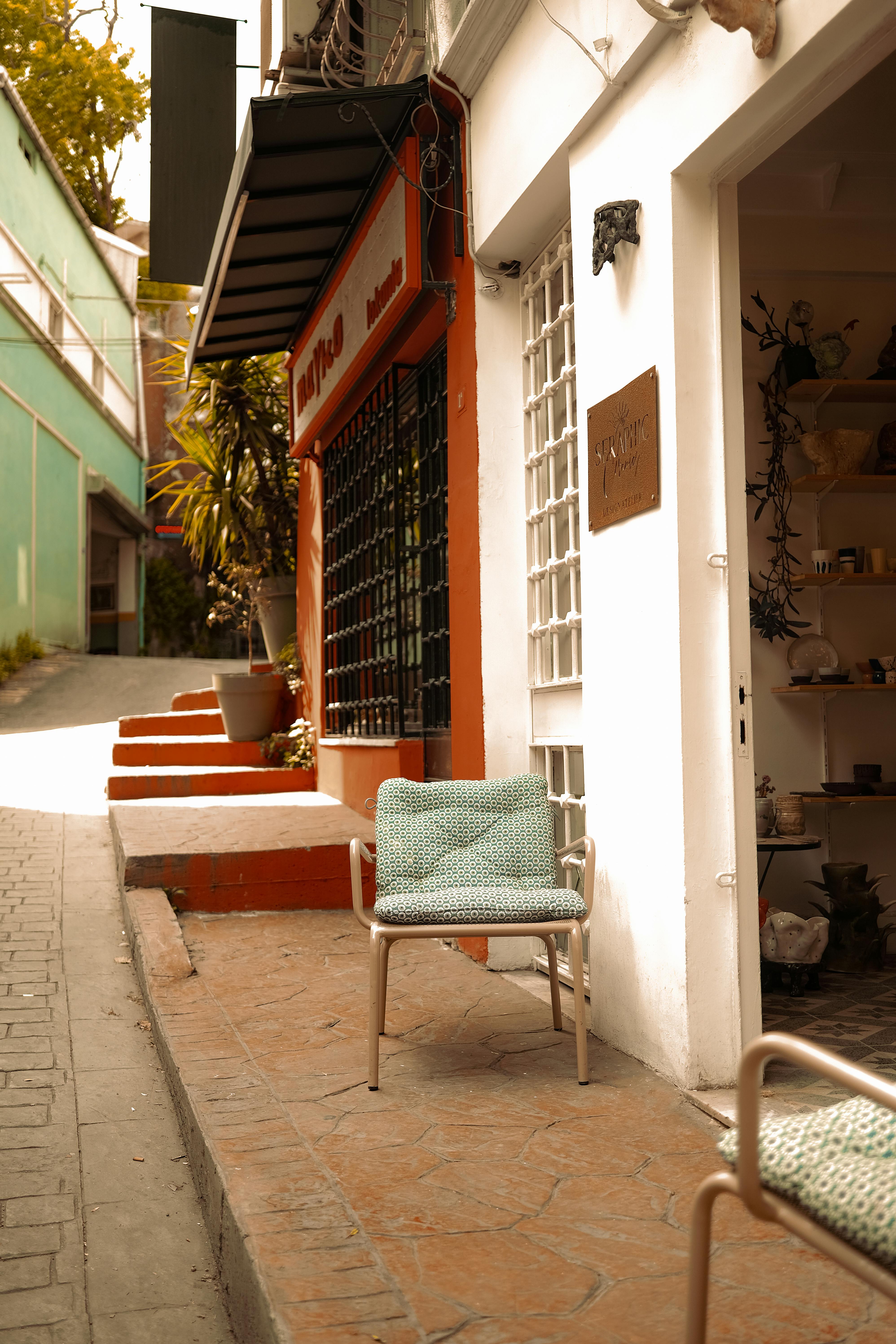 Chairs on the Sidewalk outside a Building · Free Stock Photo