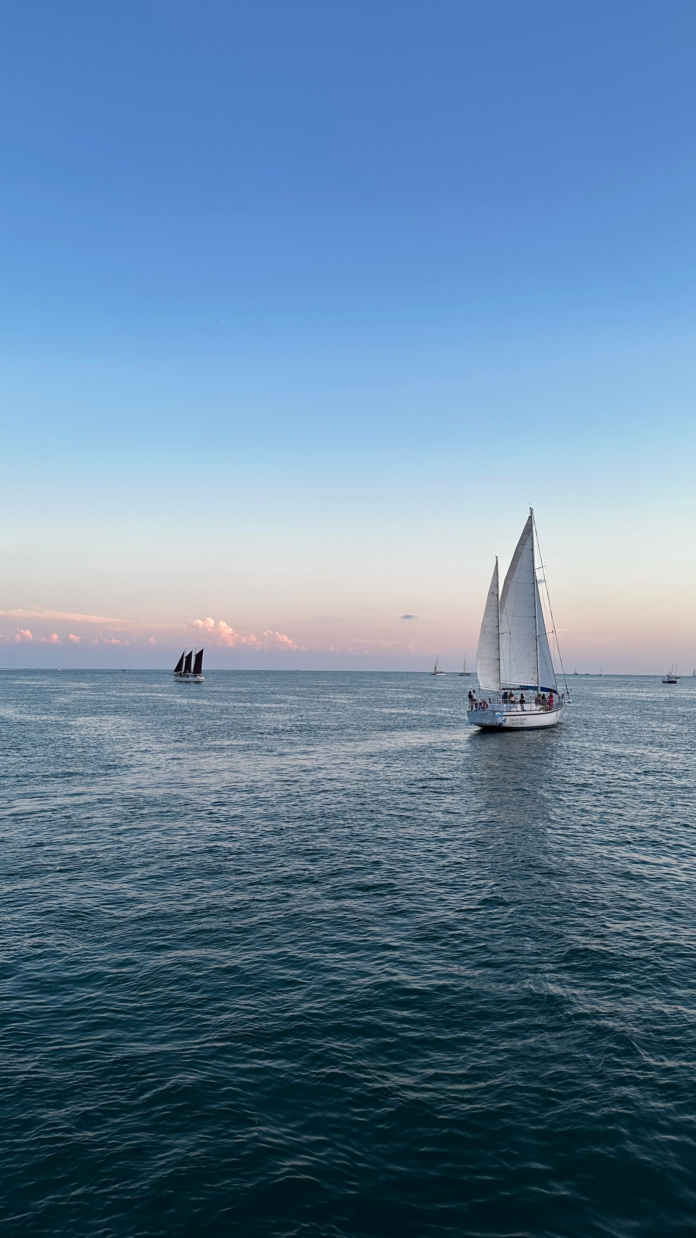 Two Boats on Calm Ocean Waters · Free Stock Photo
