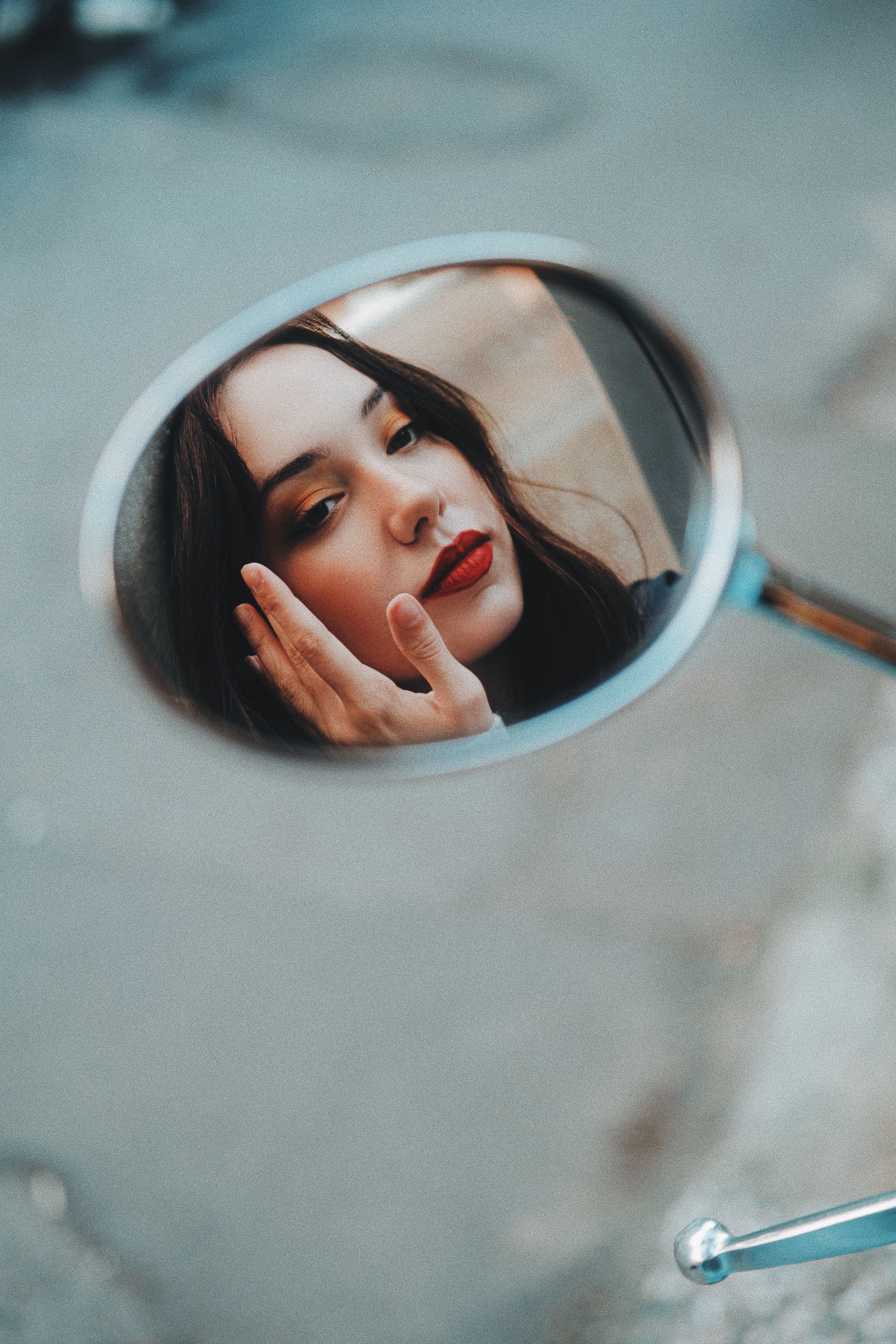 Woman Face Reflection in Scooter Mirror · Free Stock Photo
