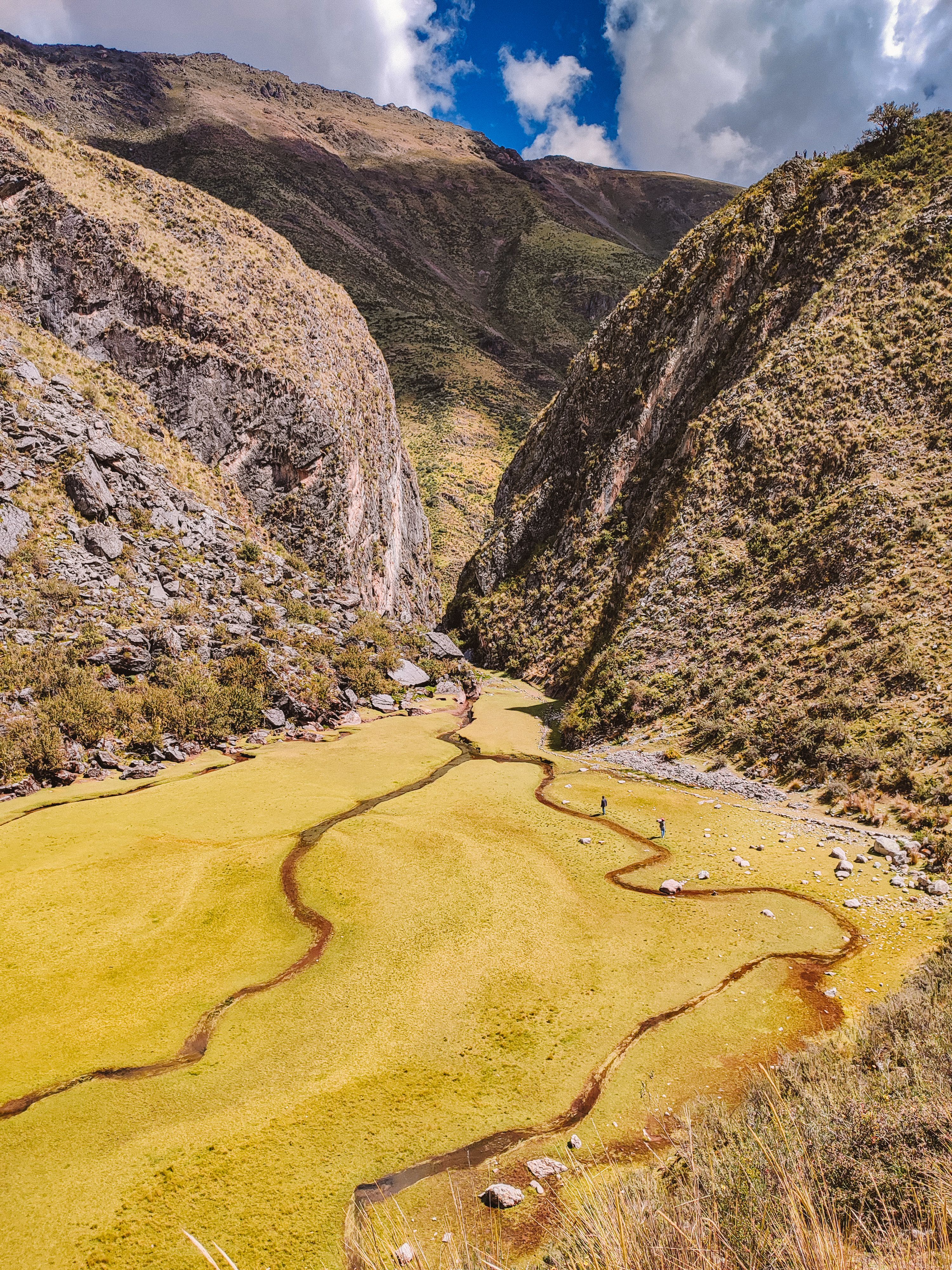 View of a Yellow River between Rocky Cliffs · Free Stock Photo