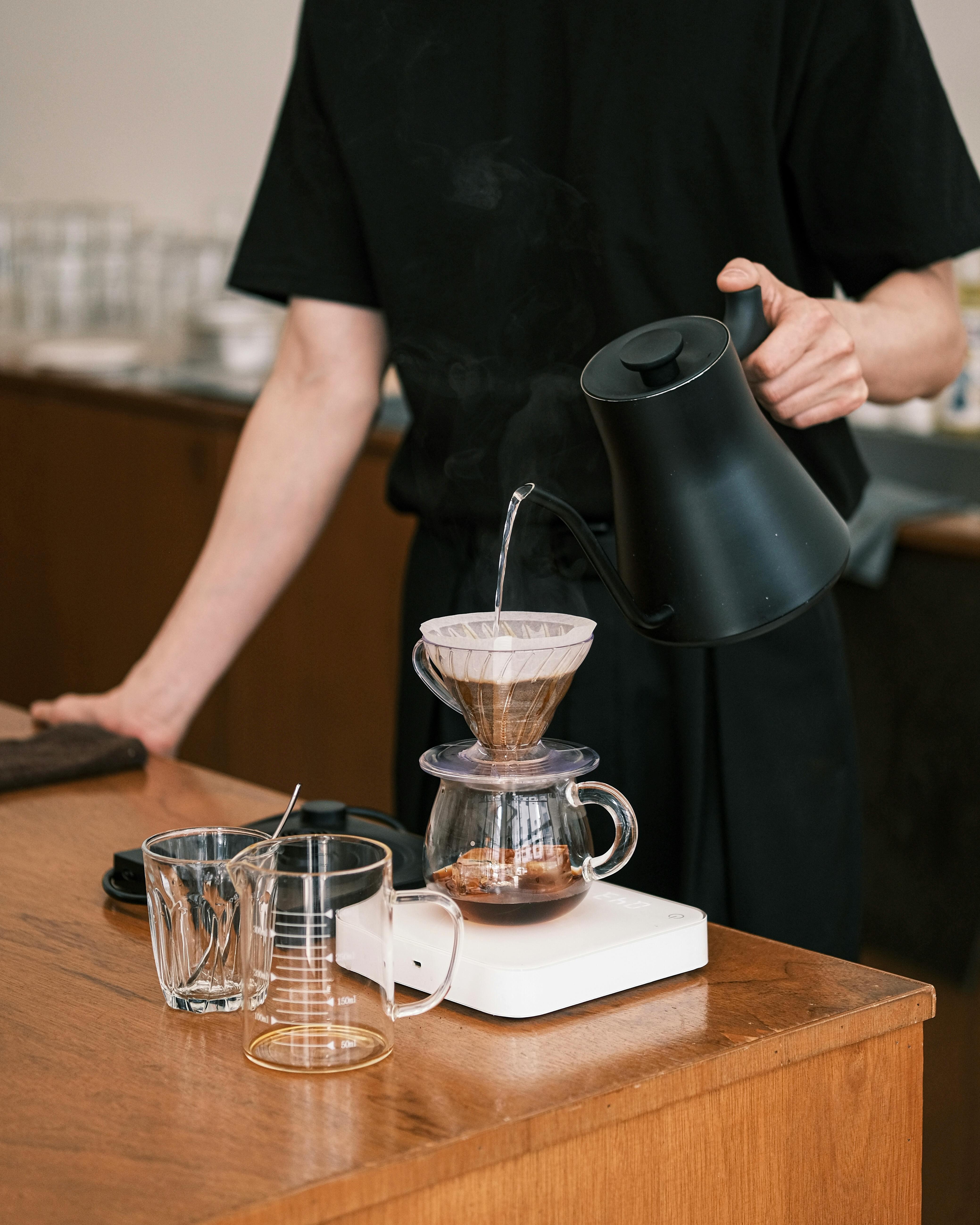 Female Barista Brewing Coffee · Free Stock Photo
